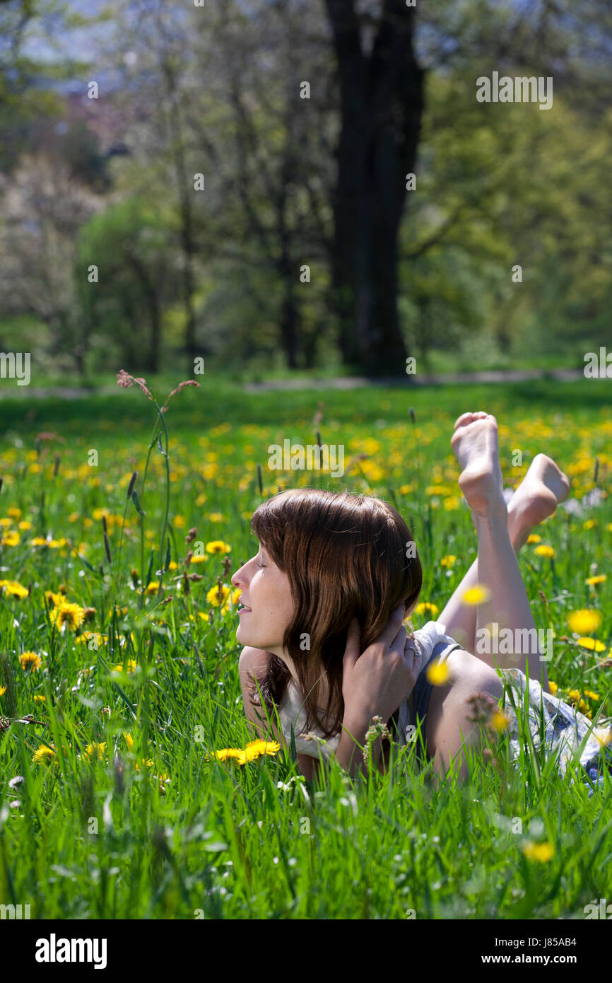 young woman enjoying barefoot in a meadow spring Stock Photo - Alamy