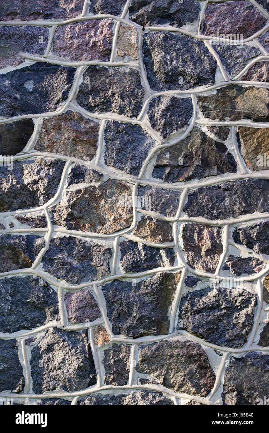 Old stone vertical wall rustic texture background. Blue and gray retro ...