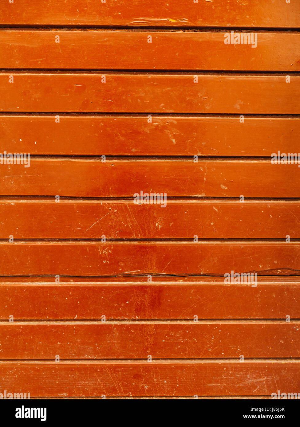 Old yellow, brown, red doors. Wood texture. Old shabby irradiated paint ...