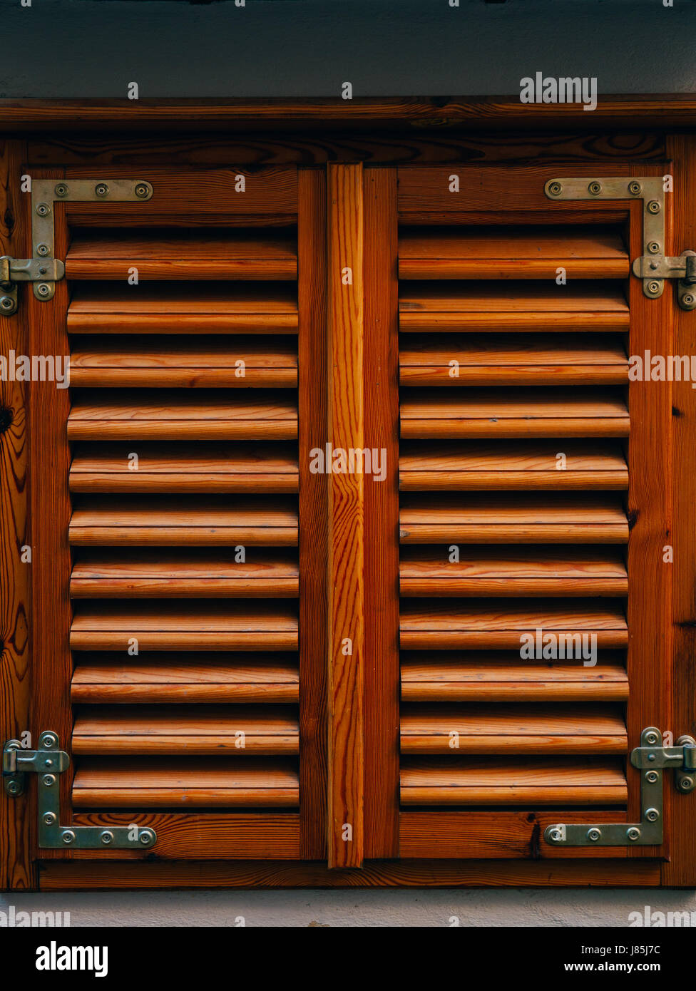 Wooden brown window shutters. The facade of houses in Montenegro Stock ...