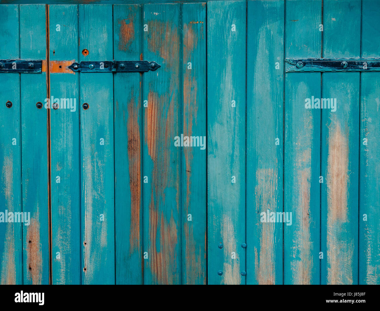Old blue doors. Wood texture. Texture of metal. Old shabby, irradiated ...