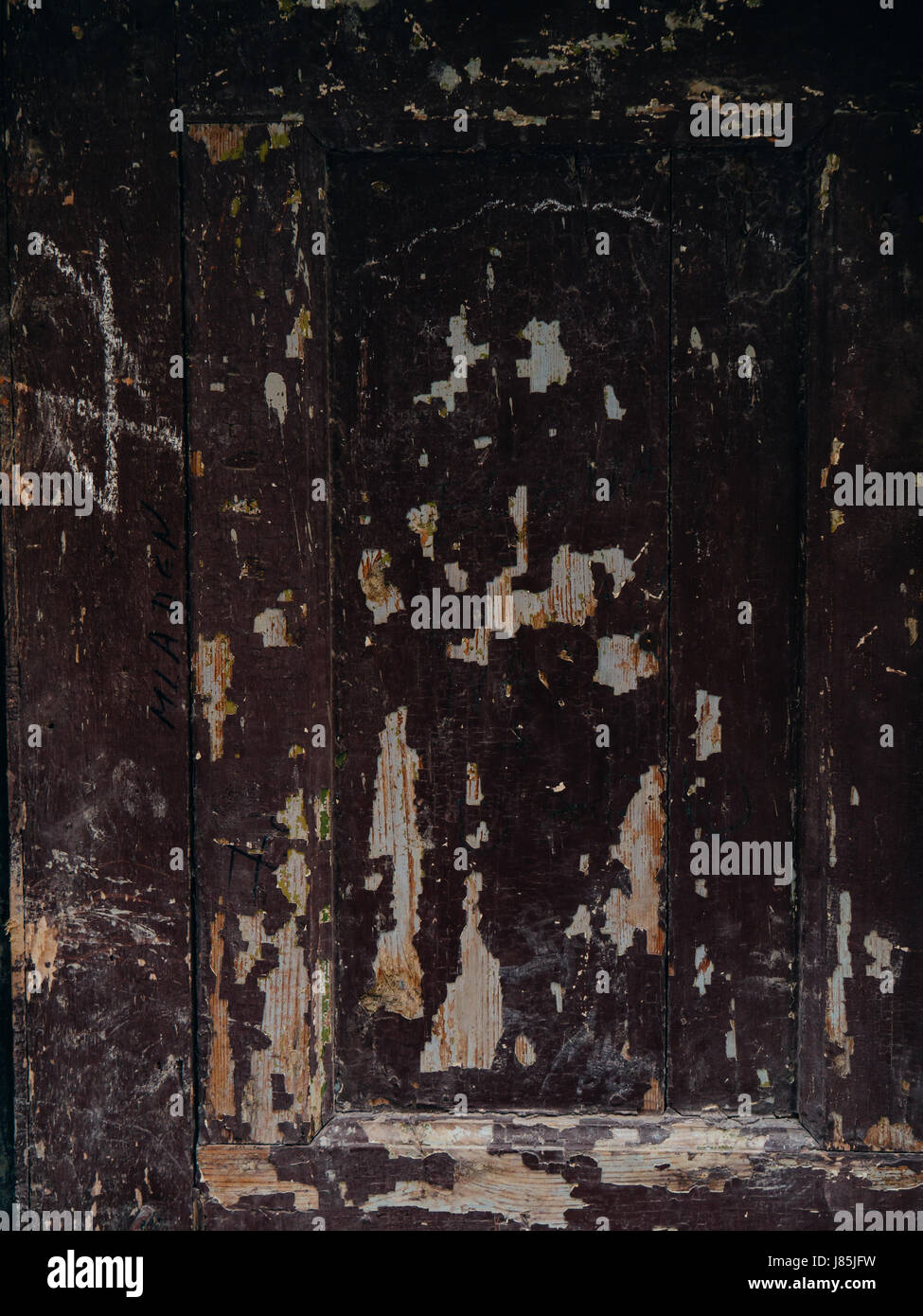 Old yellow, brown, red doors. Wood texture. Old shabby irradiated paint ...