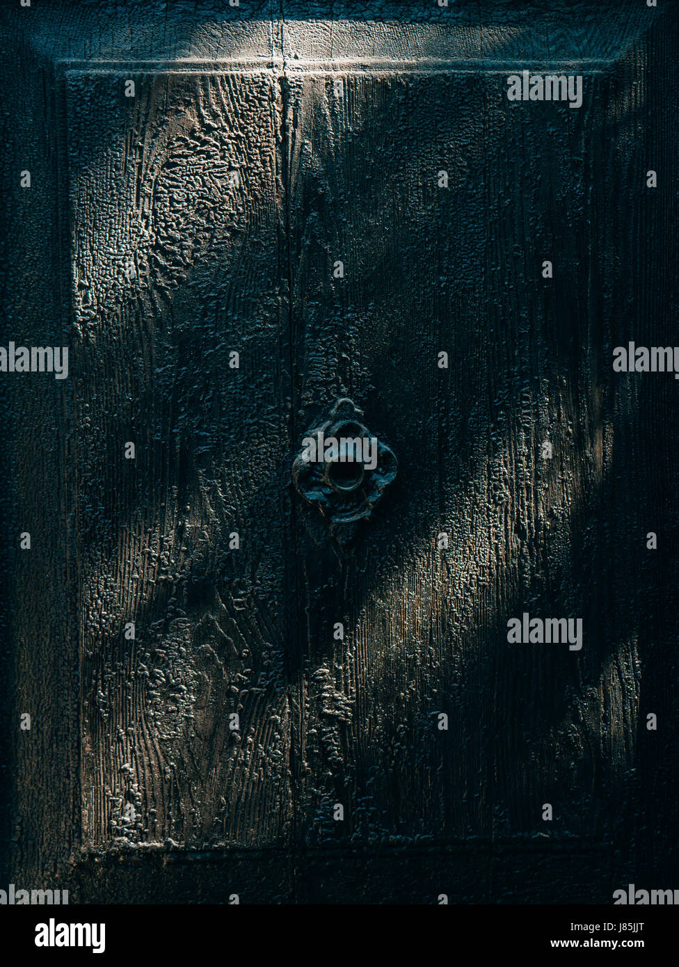 Old black doors. Wood texture. Texture of metal. Old shabby, irradiated ...