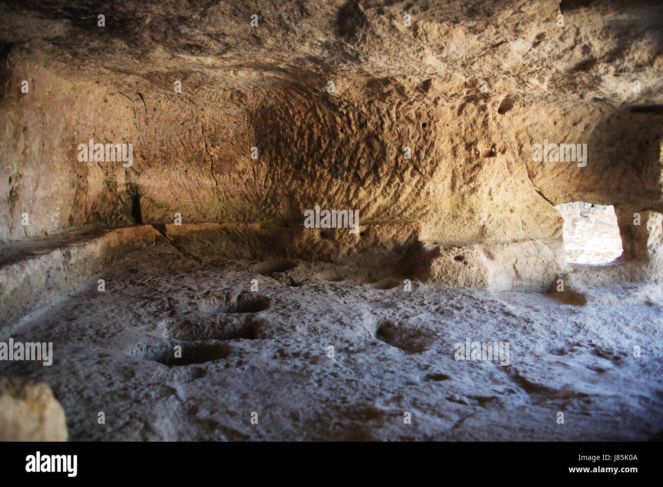 Ancient construction. Inside old dwelling cave made in the rock Stock ...