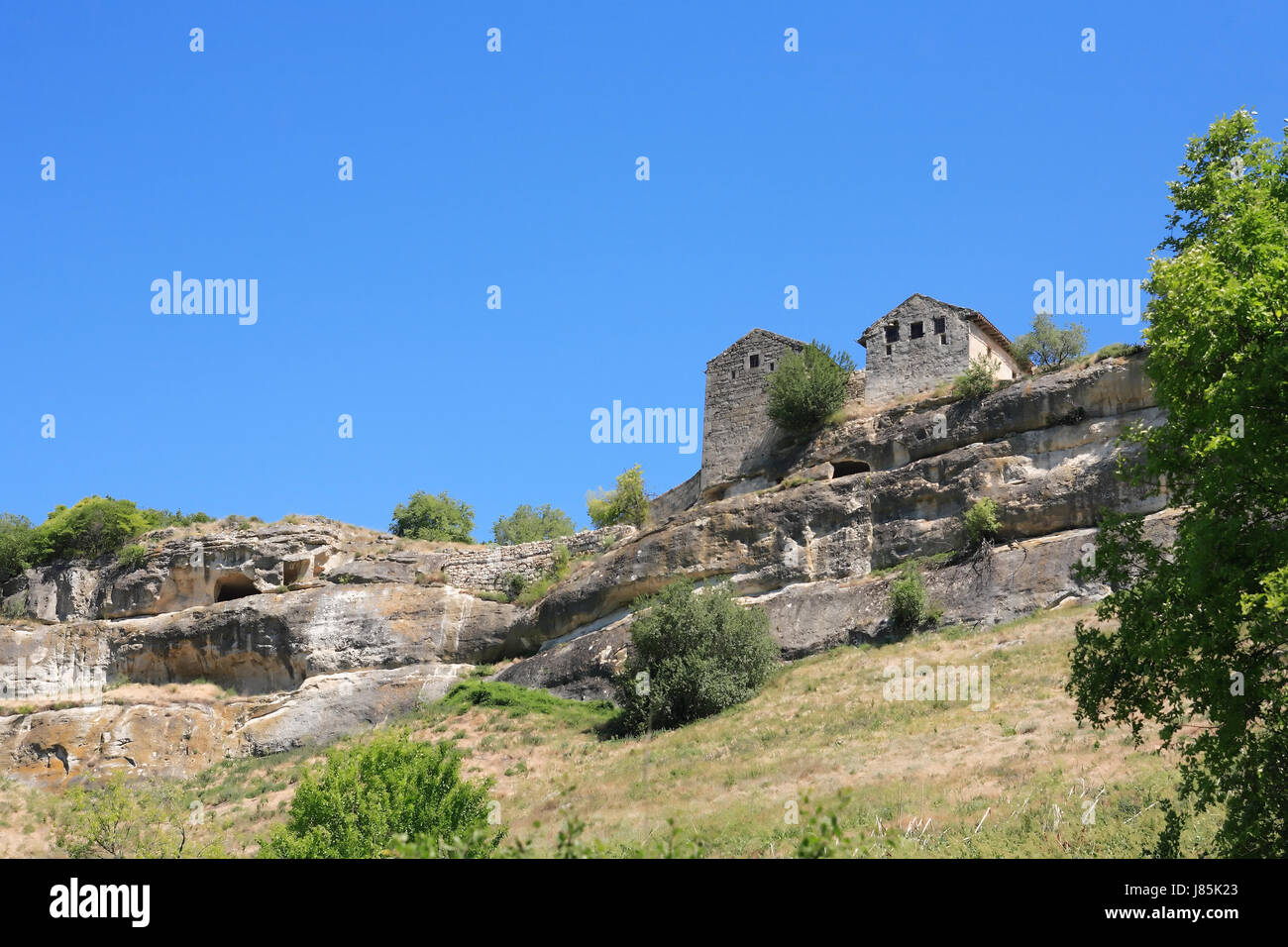 Ancient stone stronghold on the mountain against blue sky Stock Photo ...