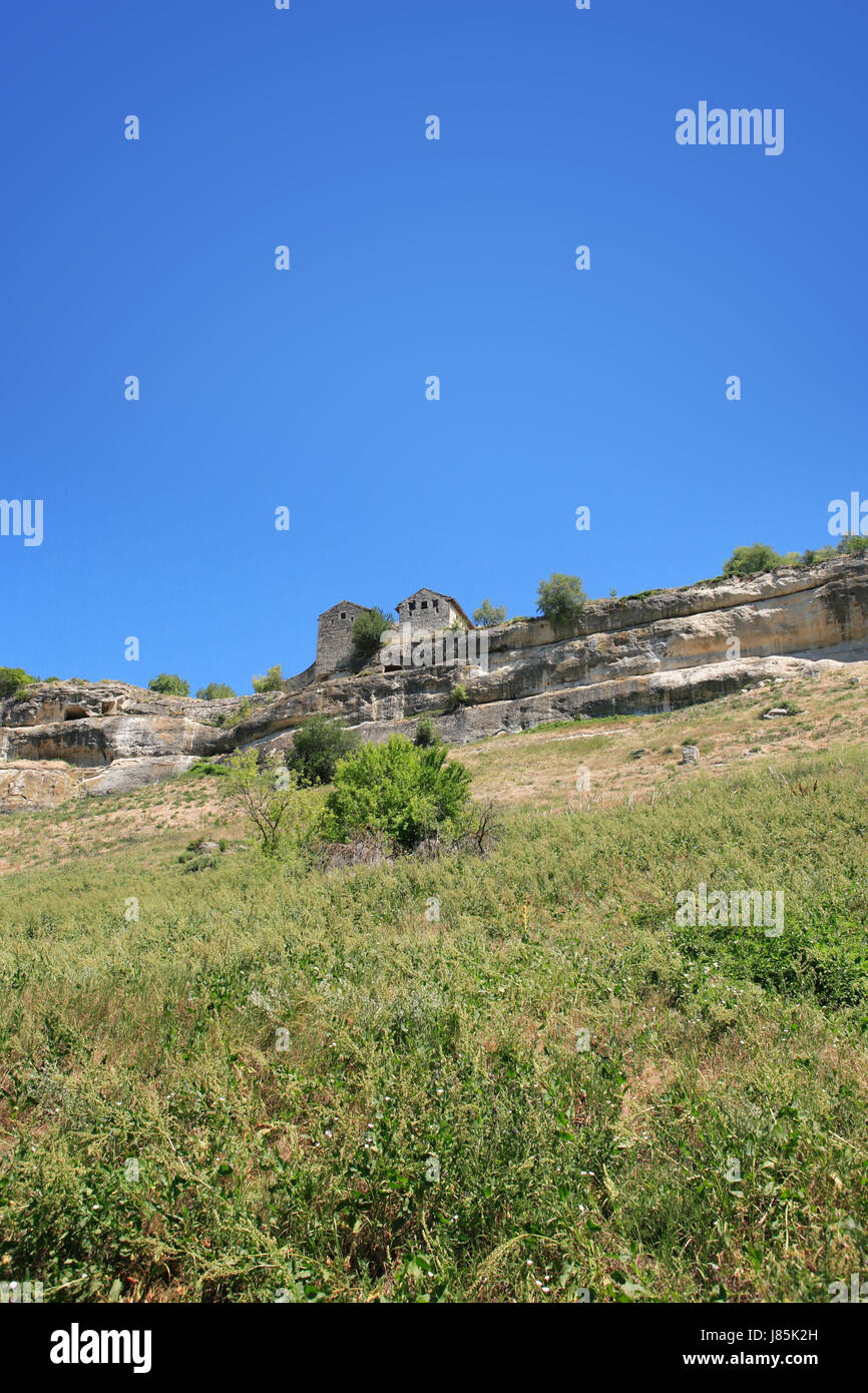 Ancient stone stronghold on the mountain against blue sky Stock Photo ...