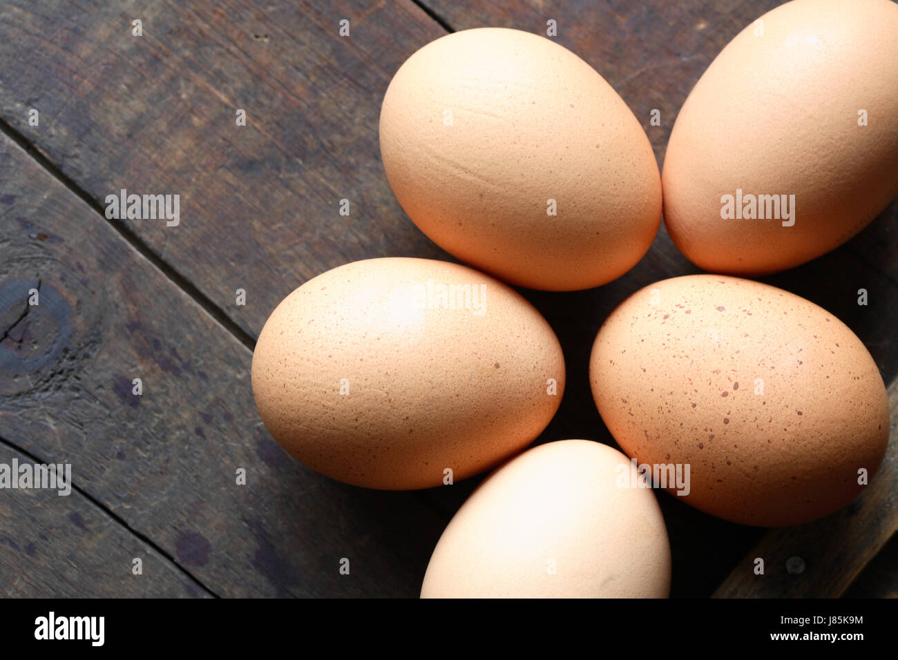 Few chicken eggs on wooden surface with free space for text Stock Photo ...