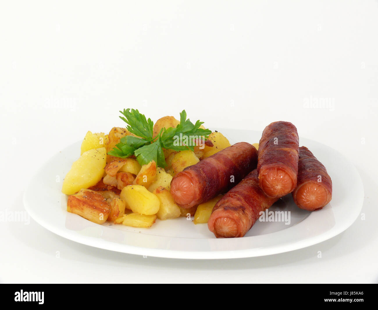 bernese bacon sausages with fried potatoes Stock Photo - Alamy