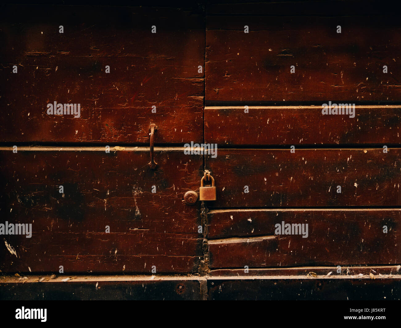 Old yellow, brown, red doors. Wood texture. Old shabby irradiated paint ...