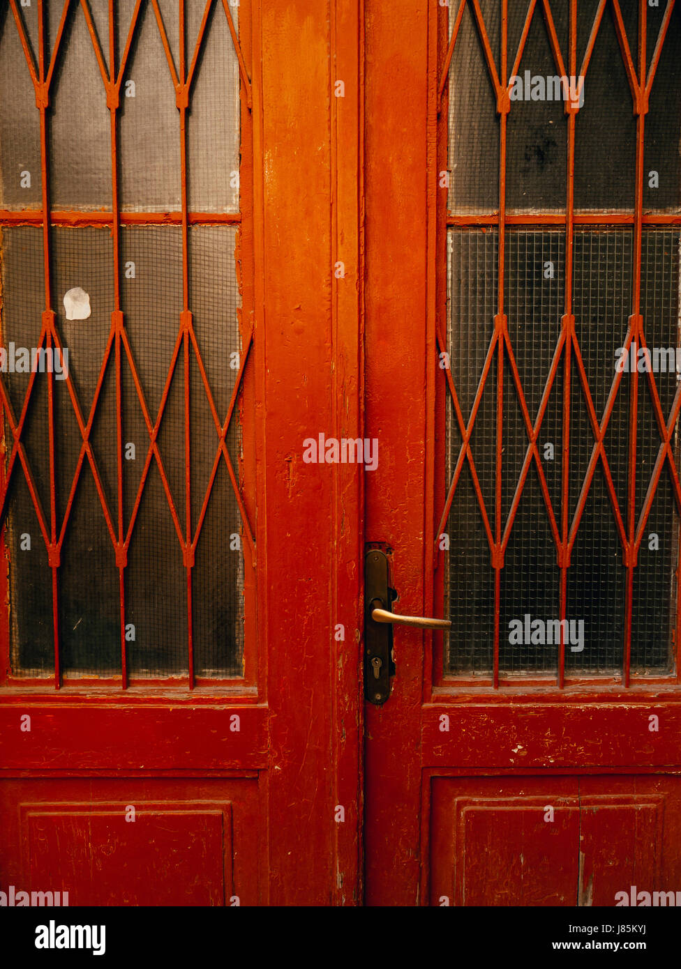 Old yellow, brown, red doors. Wood texture. Old shabby irradiated paint ...