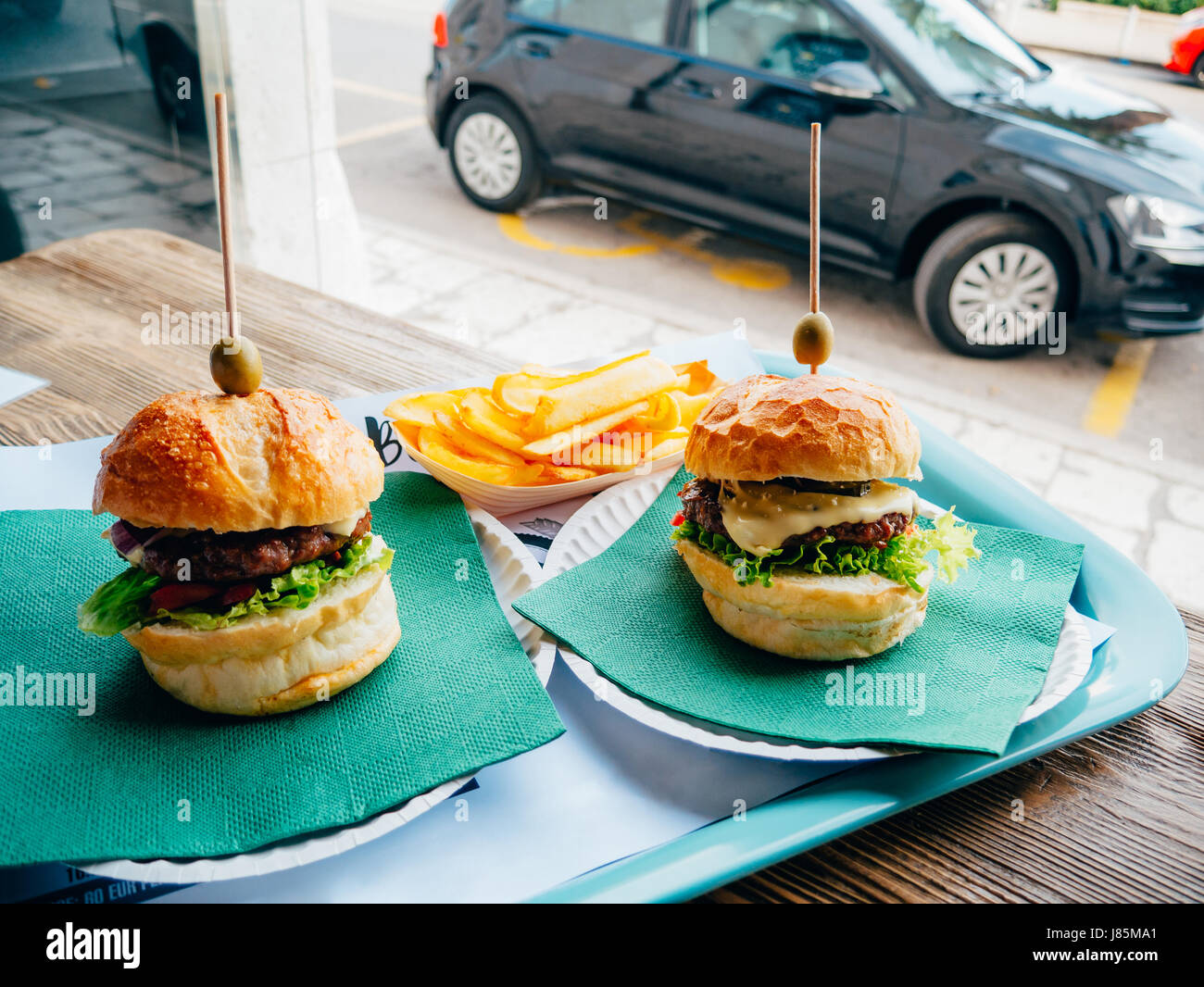 Two hamburger on a tray in a cafe. Burger Cafe in Split, on the ...