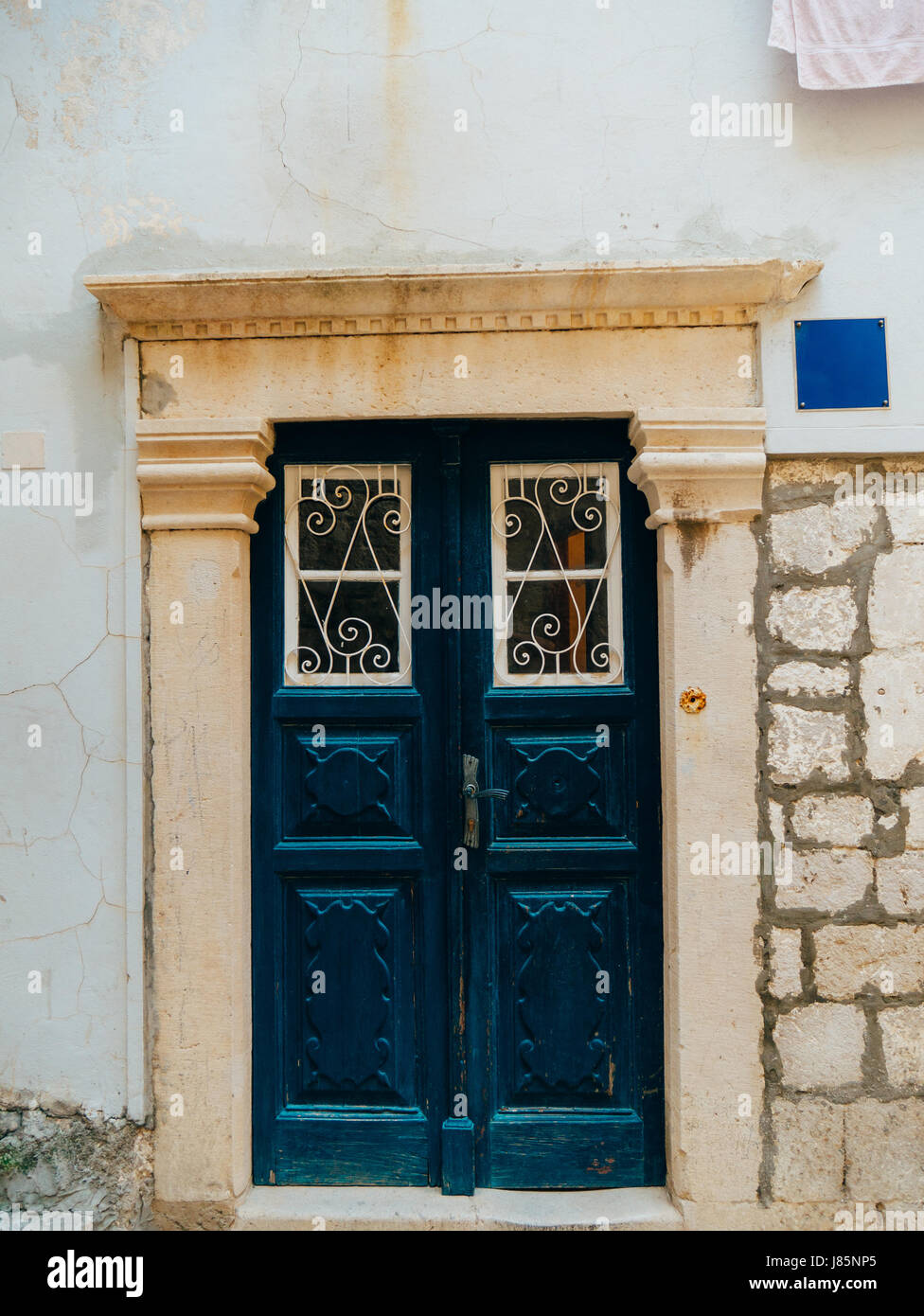 Old blue doors. Wood texture. Texture of metal. Old shabby, irradiated ...