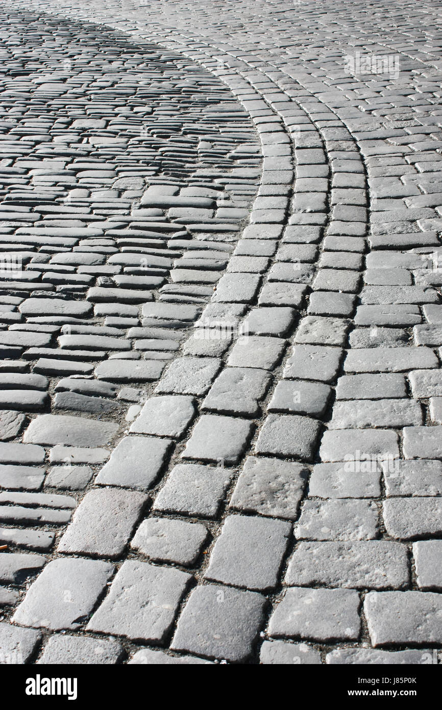 walk go going walking stone pavement cobblestone paved curves road ...