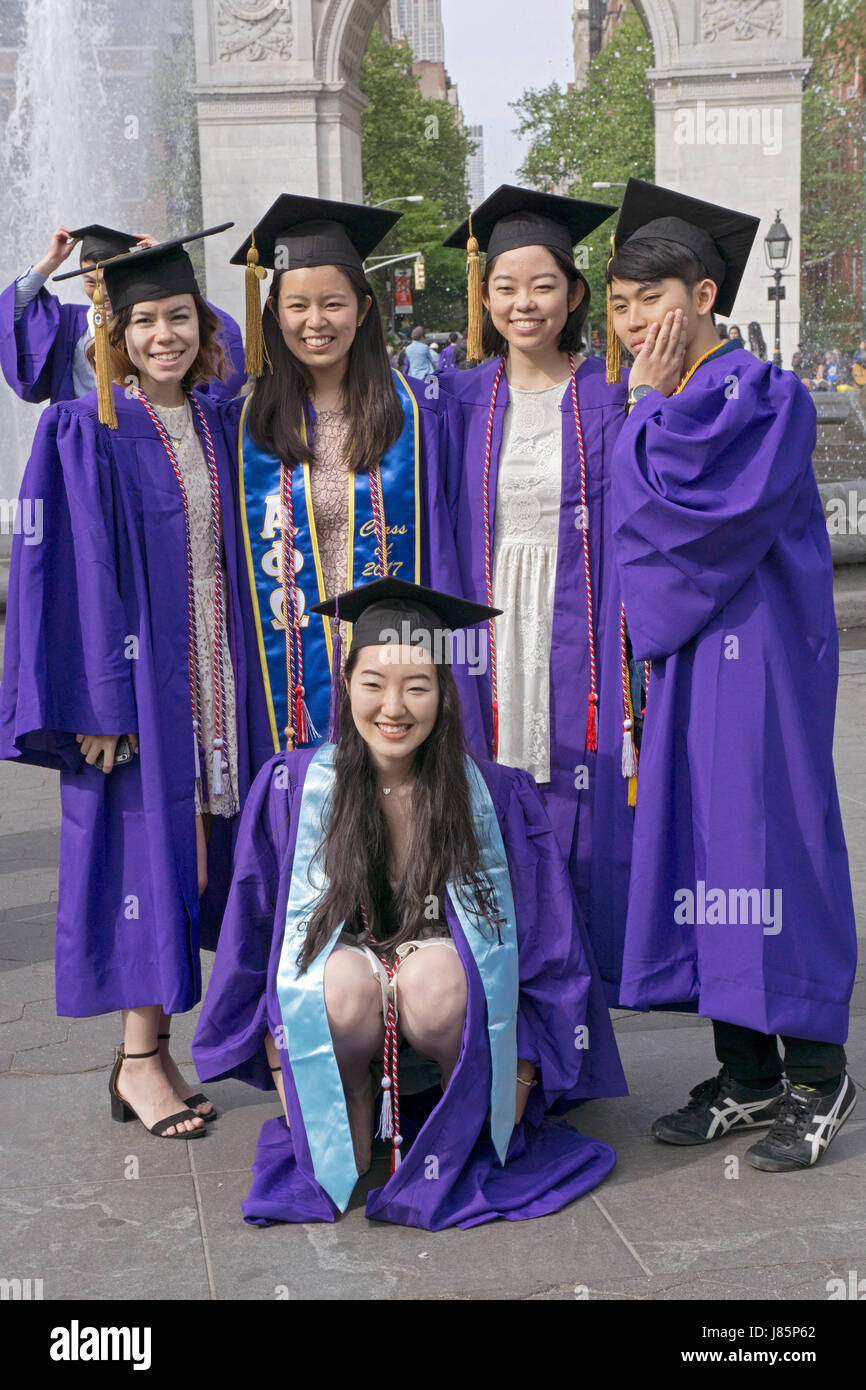 Graduates of New York University pose for a group photo in front of the ...