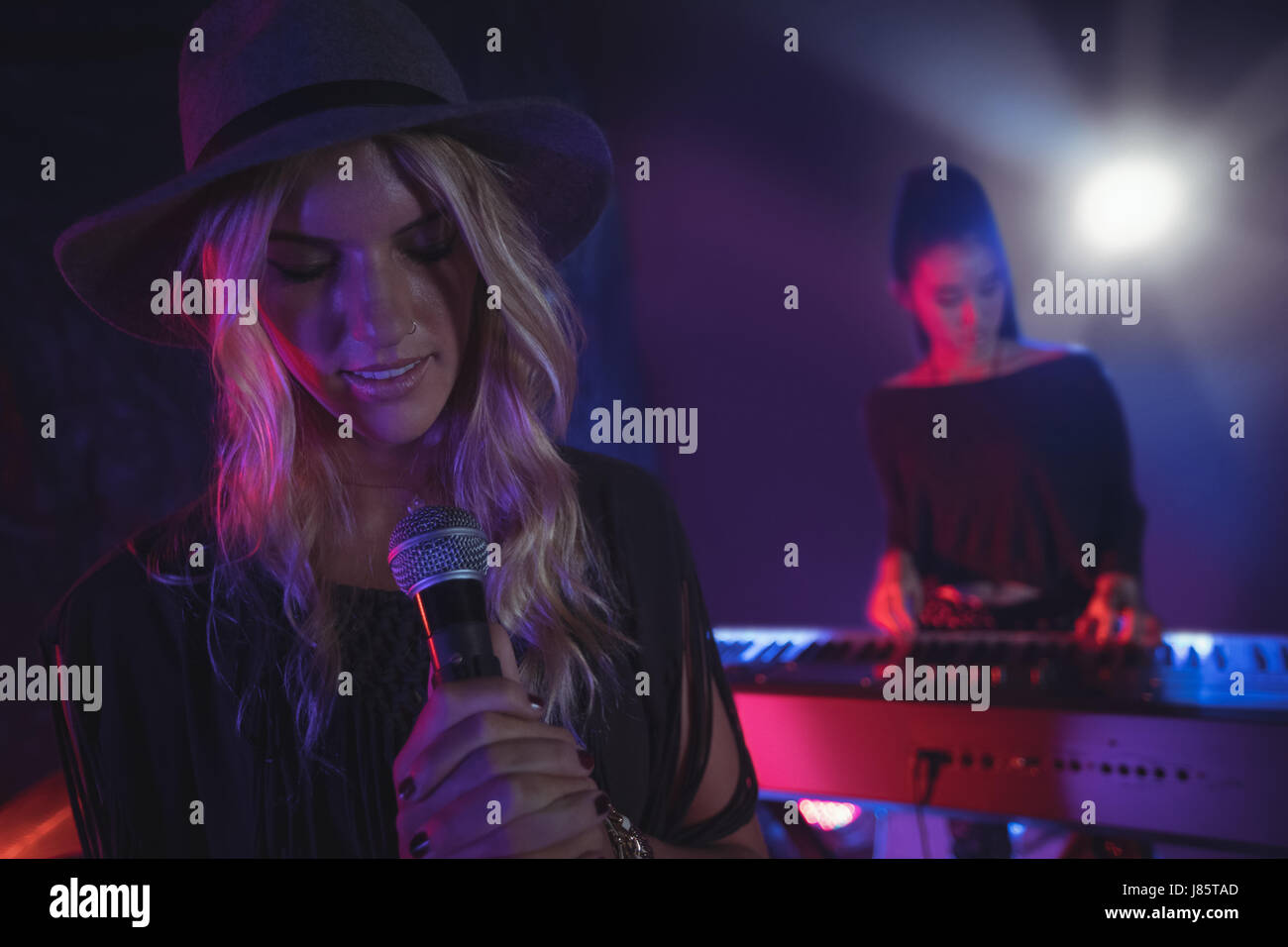 Woman Singing Playing Piano High Resolution Stock Photography and ...