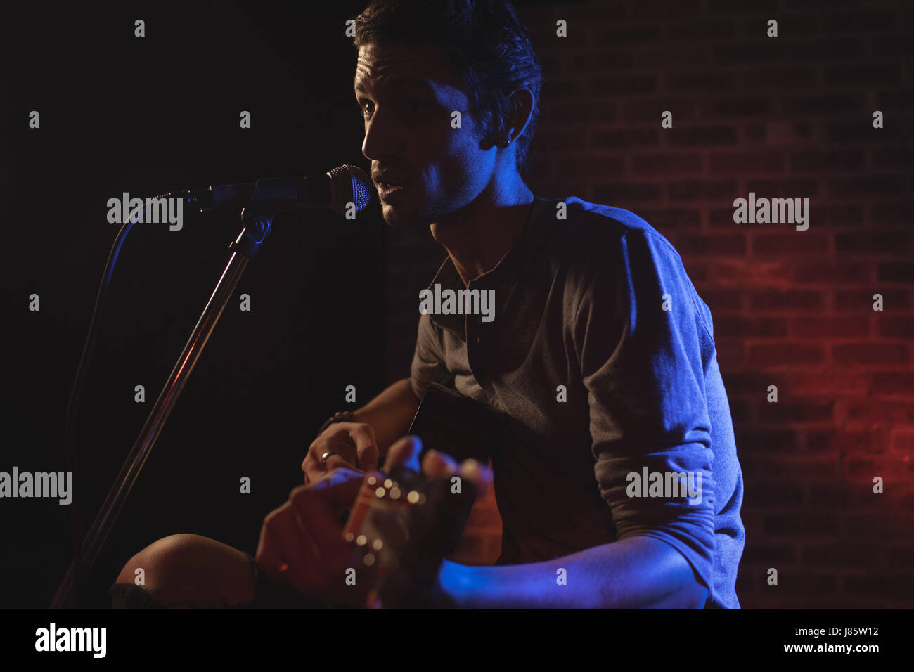 Singer Playing Guitar High Resolution Stock Photography and Images - Alamy