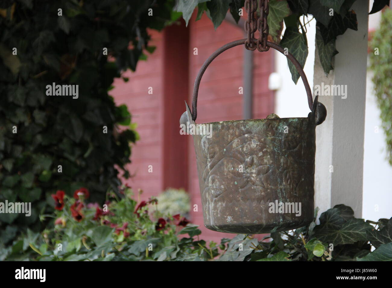 hanging bucket in the garden Stock Photo - Alamy
