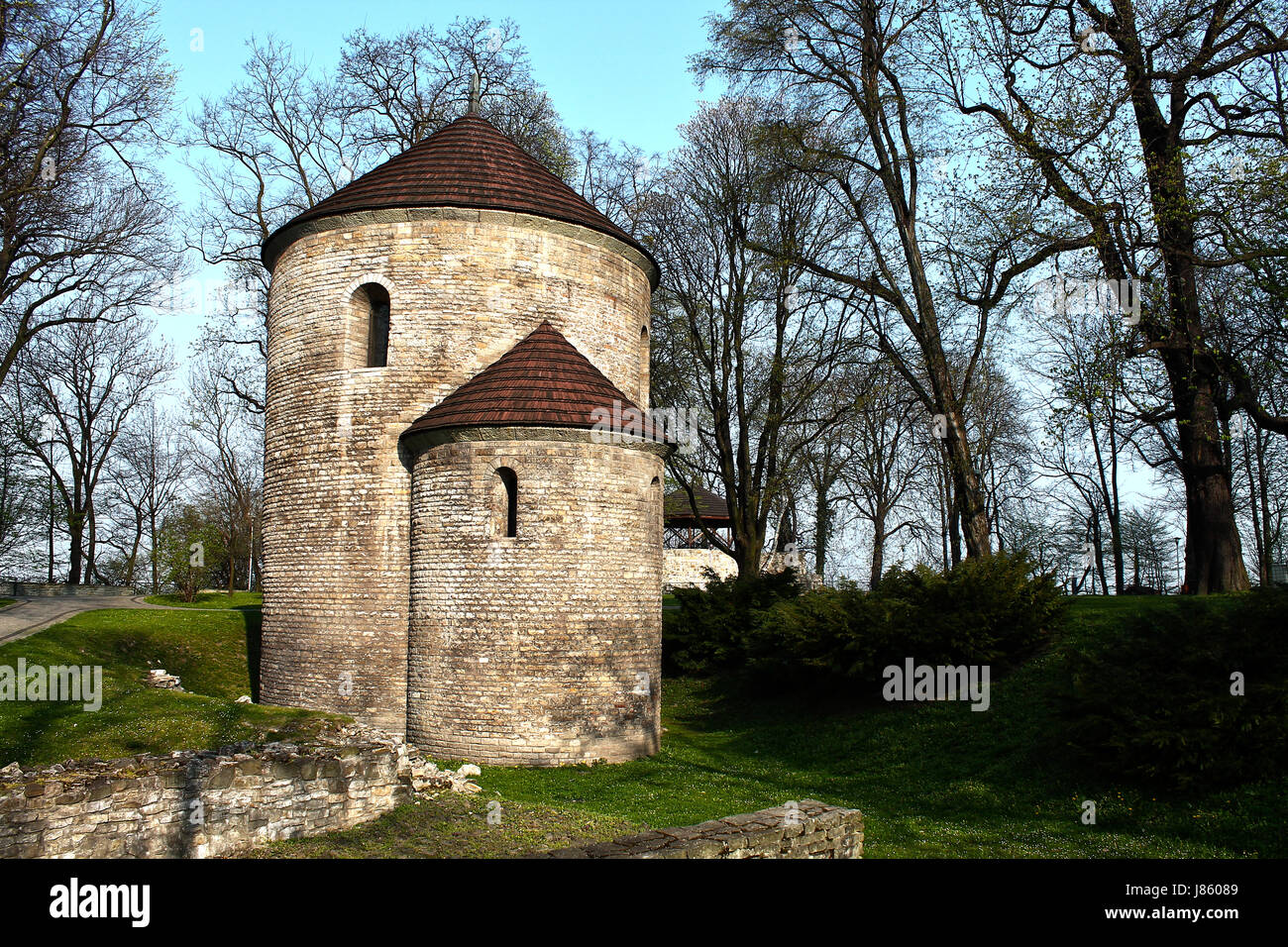 An ancient stone tower decorating the park Stock Photo - Alamy