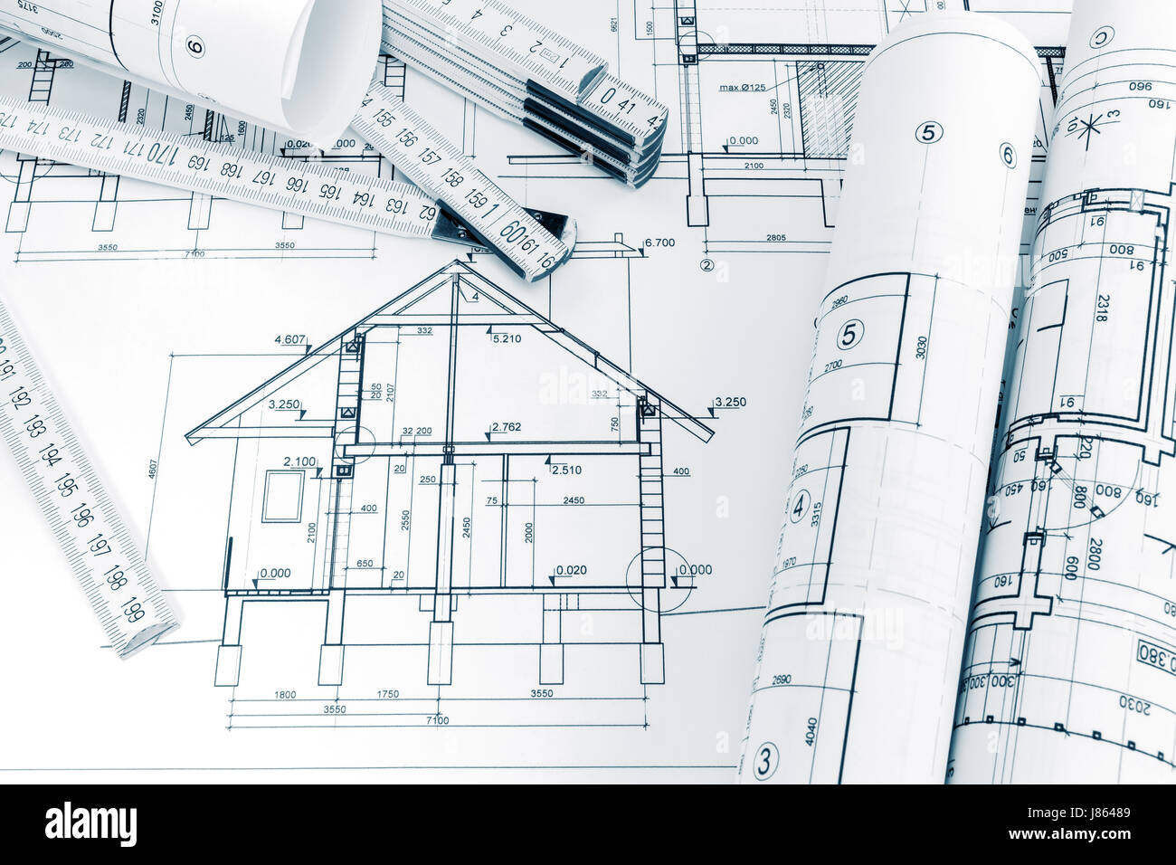 engineering plans of house renovation and folding ruler on architects ...