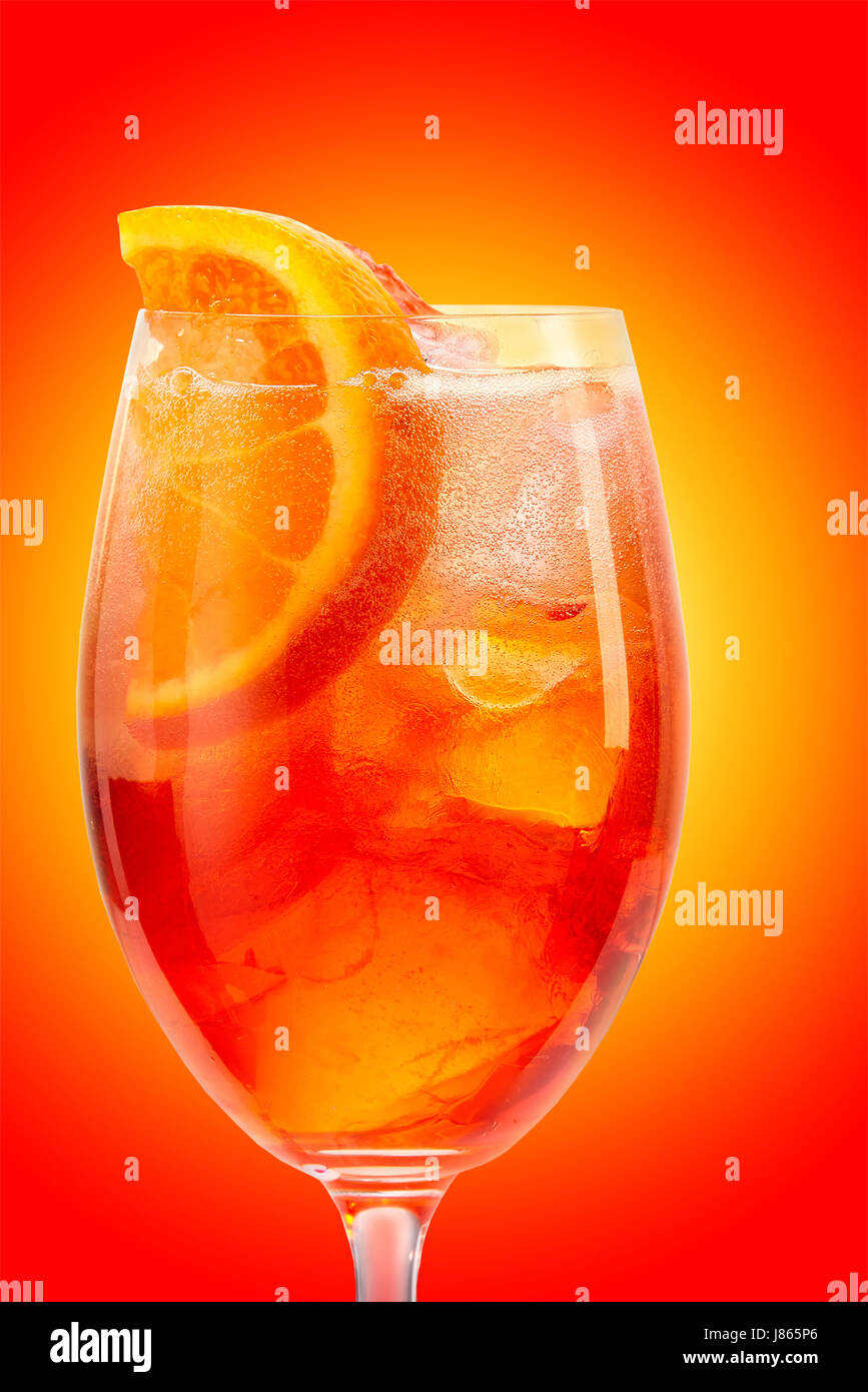 glass of aperol spritz cocktail on colorful background Stock Photo - Alamy