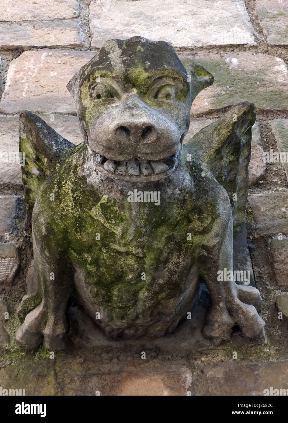medieval gargoyle with wings claws and teeth Stock Photo - Alamy