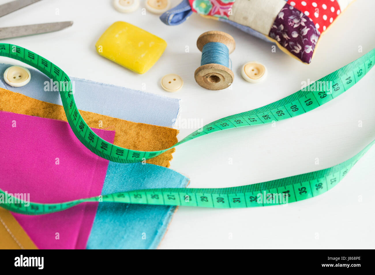 sewing, patchwork, tailoring and fashion concept - close-up on tools of ...