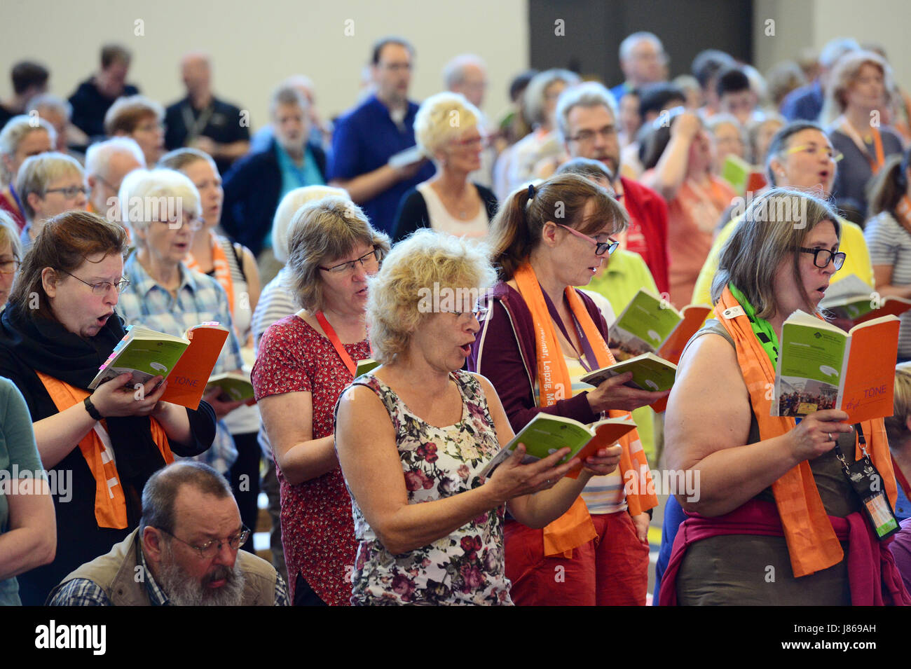 Participants of the German Protestant Church Congress sind during a ...