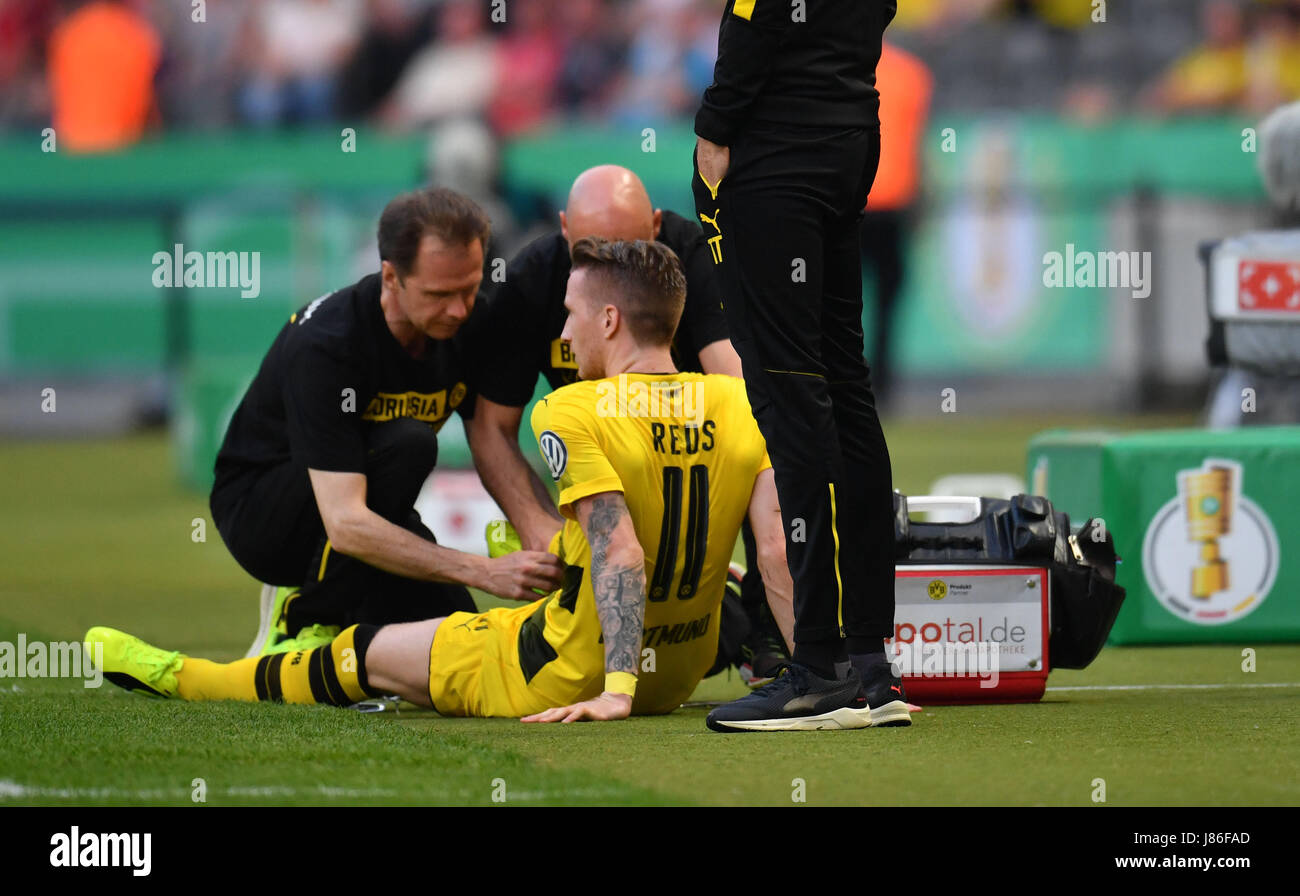 Berlin, Germany. 27th May, 2017. Dortmund's Marco Reus is treated ...