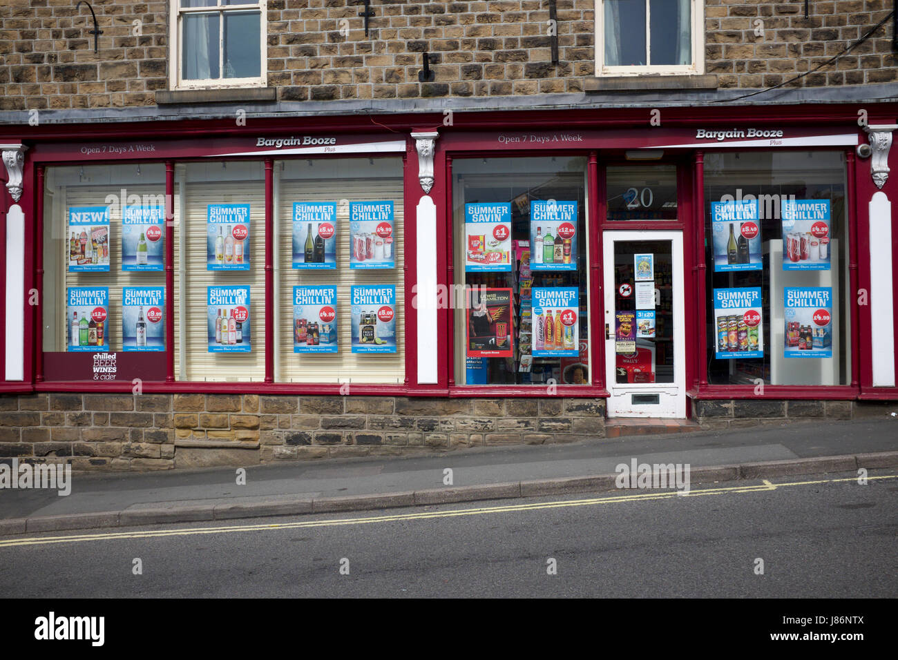 The Bargain Booze shop on Market Street, New Mills, Derbyshire Stock ...