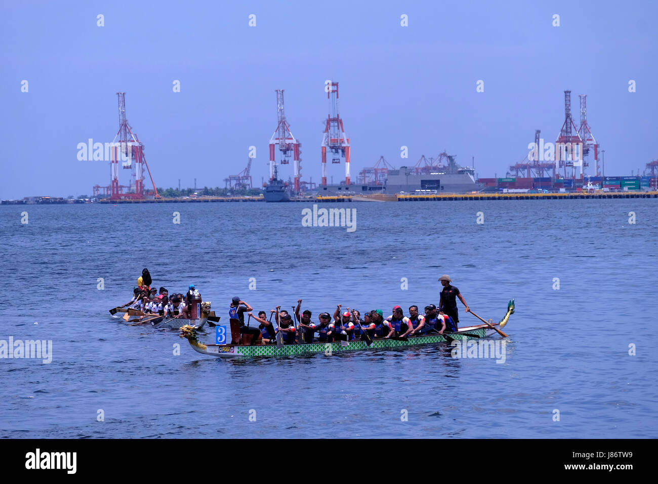 View of Manila south port in background with rowers paddling calmly ...