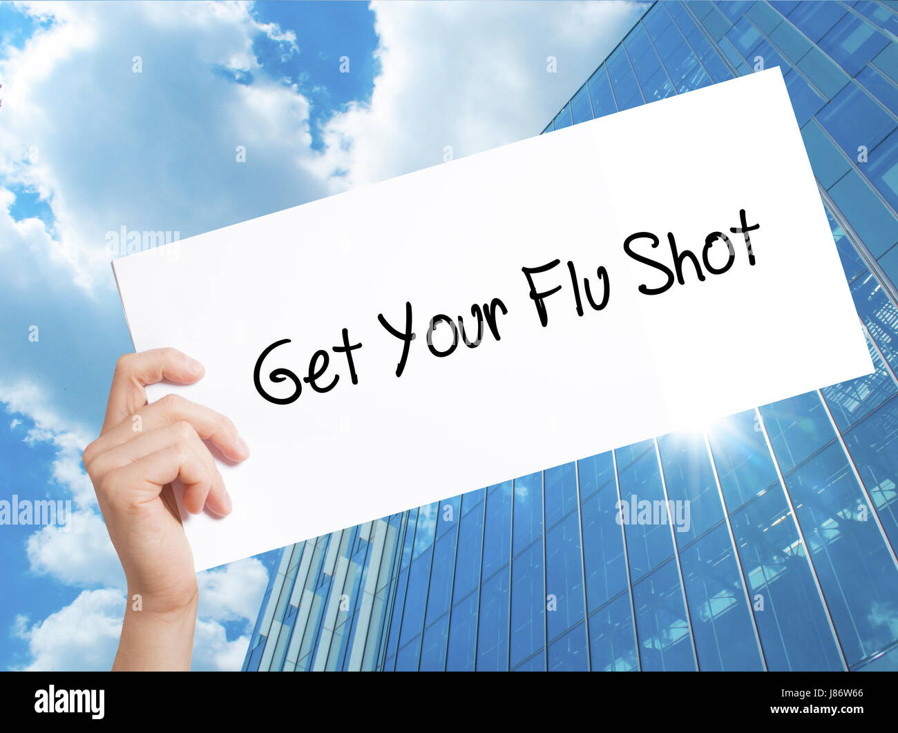 Get Your Flu Shot Sign on white paper. Man Hand Holding Paper with text ...