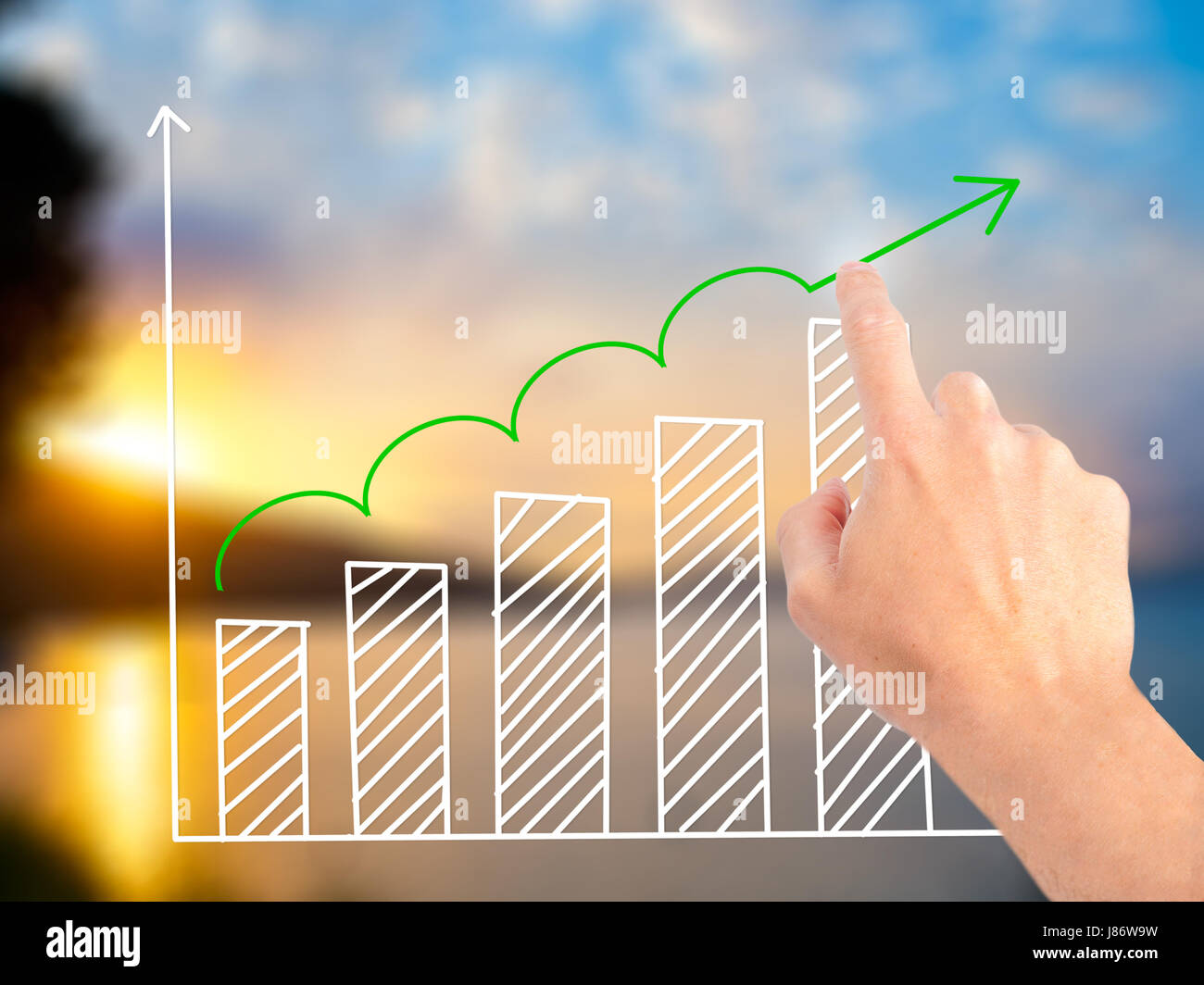 Businessman hand pressing Sales Growth Graph on virtual screen ...