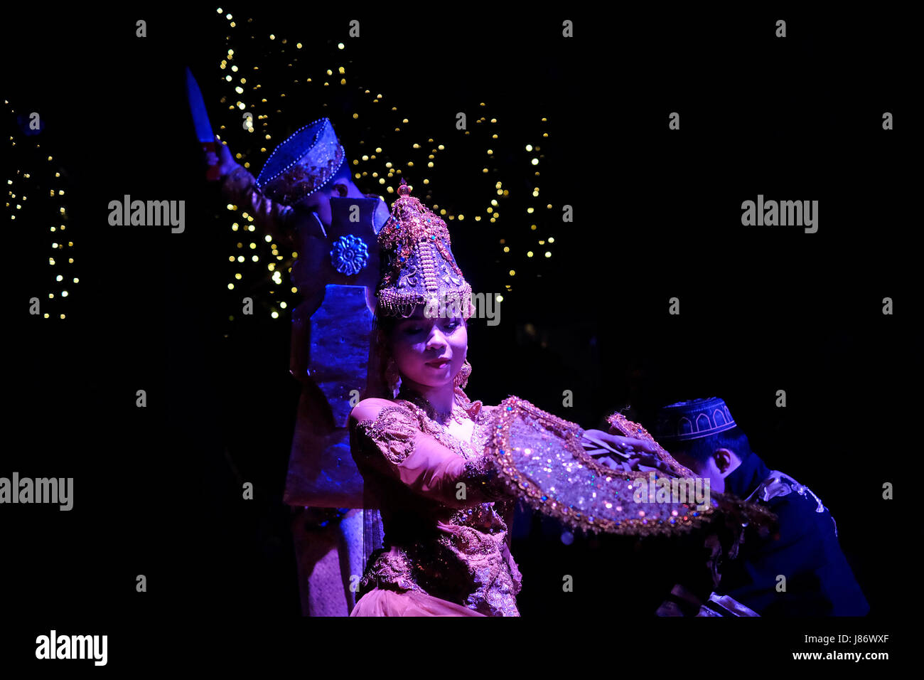 Filipino dancers performing traditional Philippine folk dance which ...