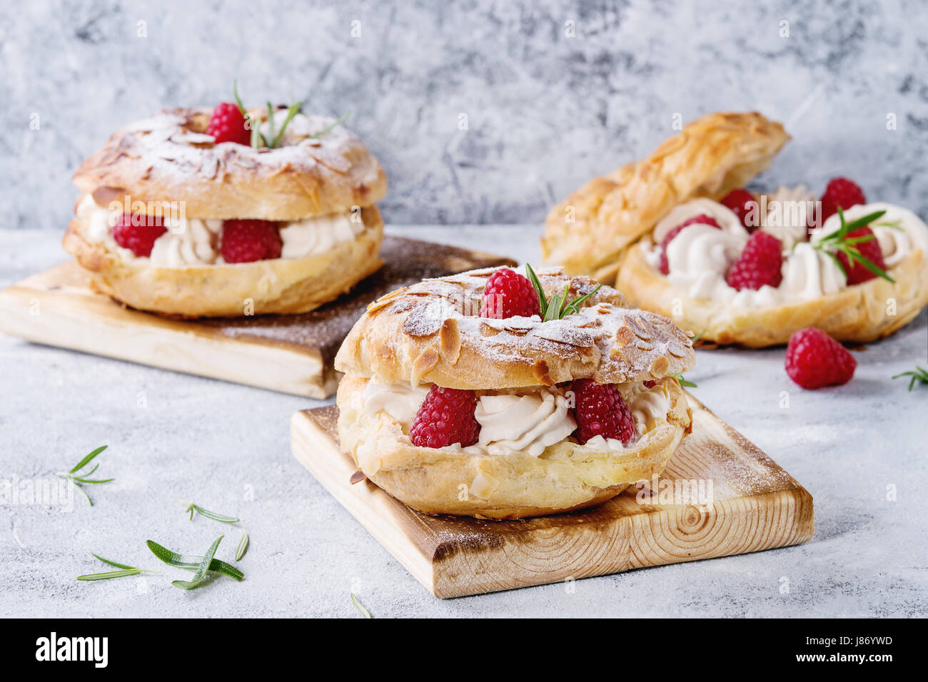 Choux cake Paris Brest with raspberries Stock Photo - Alamy