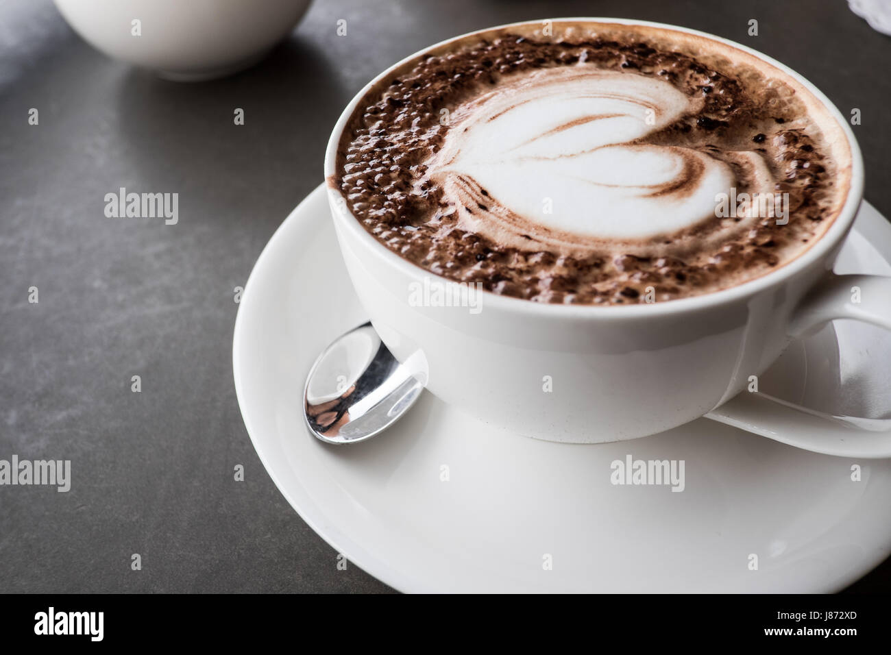 Heart shape Latte art on top of coffee cup Stock Photo - Alamy