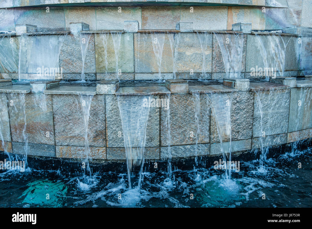 Many streams of water cascade down this fountain Stock Photo - Alamy