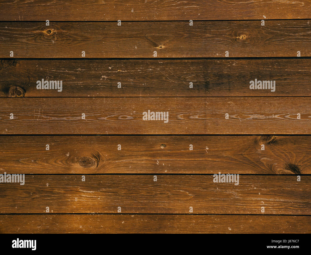 Old yellow, brown, red doors. Wood texture. Old shabby irradiated paint ...