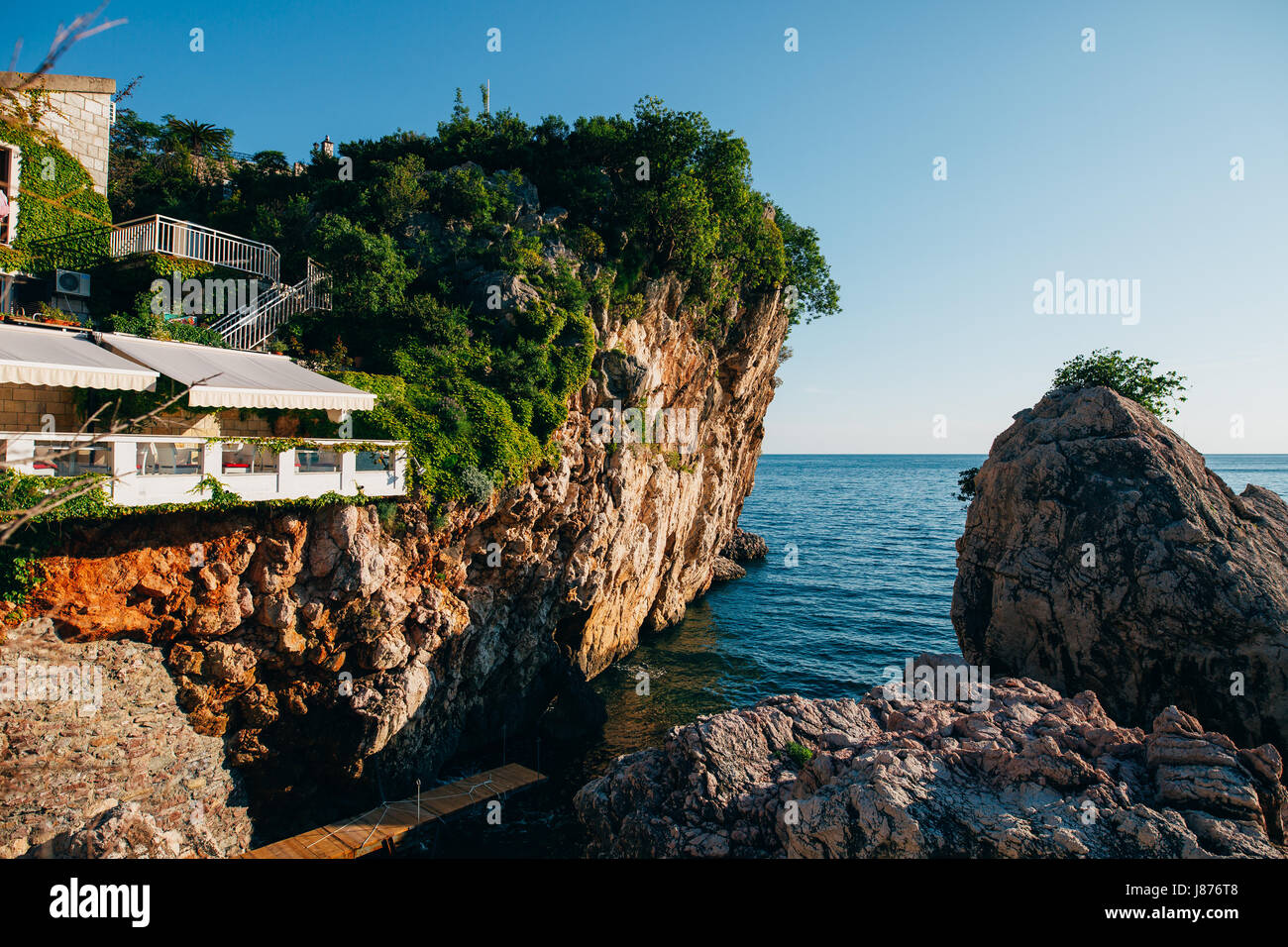 Przno, Montenegro. Restaurant on the cliff near the sea Stock Photo - Alamy