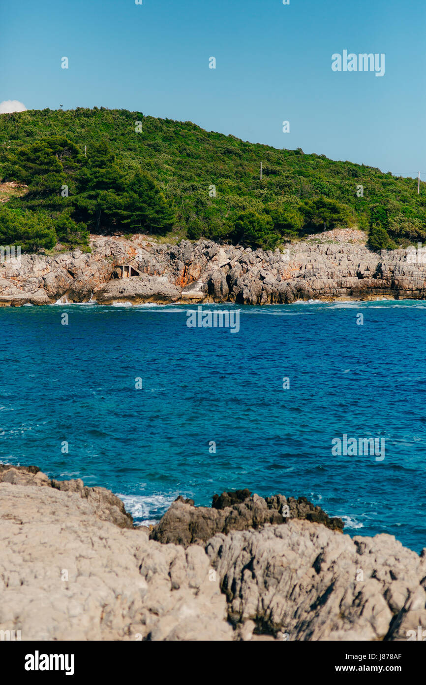 Rocks on the sea in Montenegro. Rocky coast. Wild beach. Dangerous ...