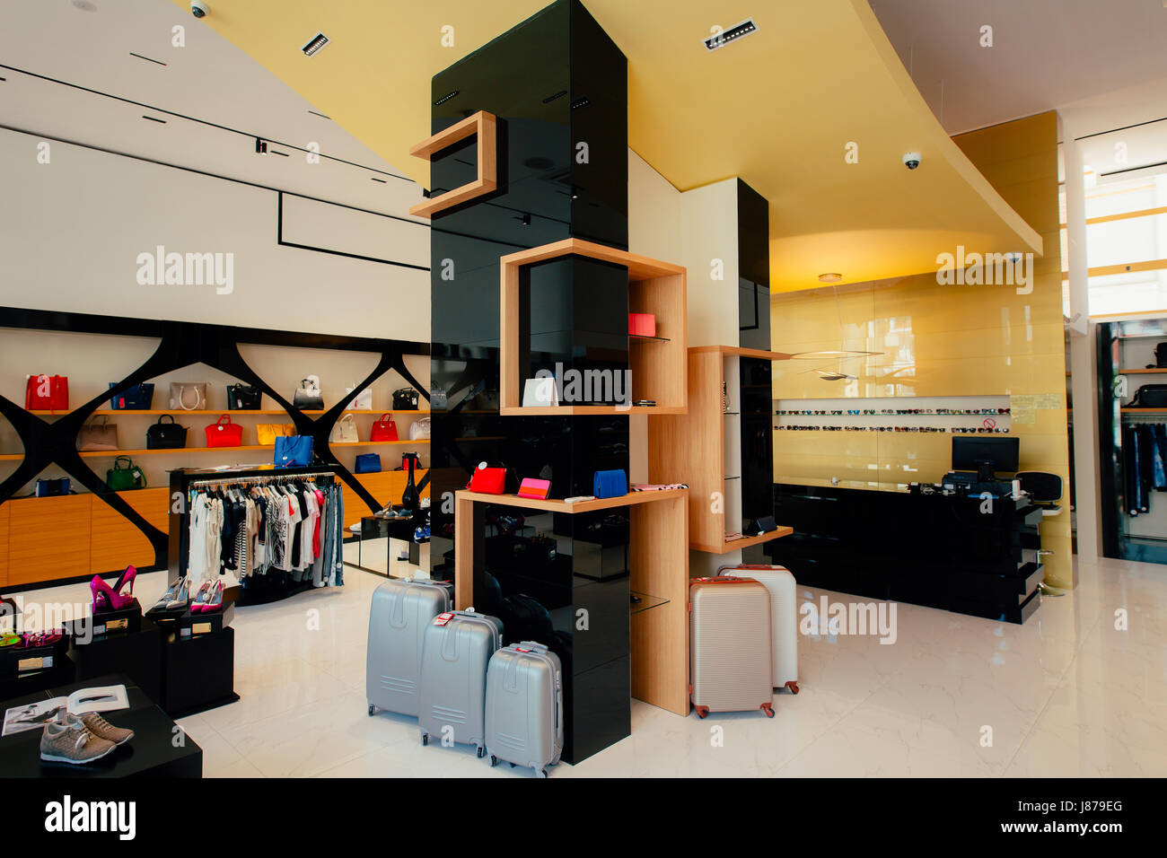 Interior of a clothing store. Clothing for men and women on the store ...