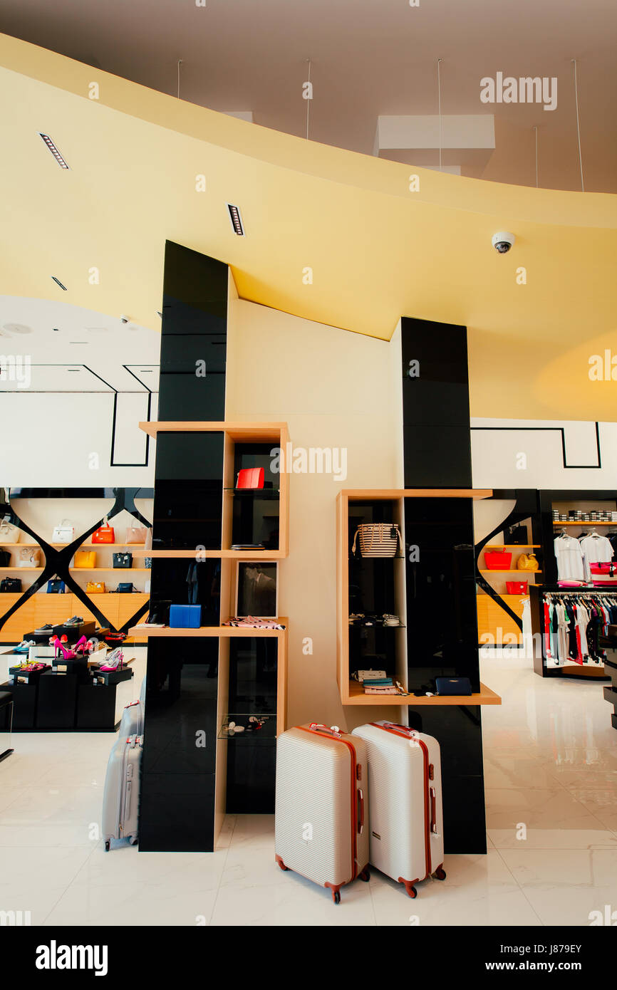 Interior of a clothing store. Clothing for men and women on the store ...