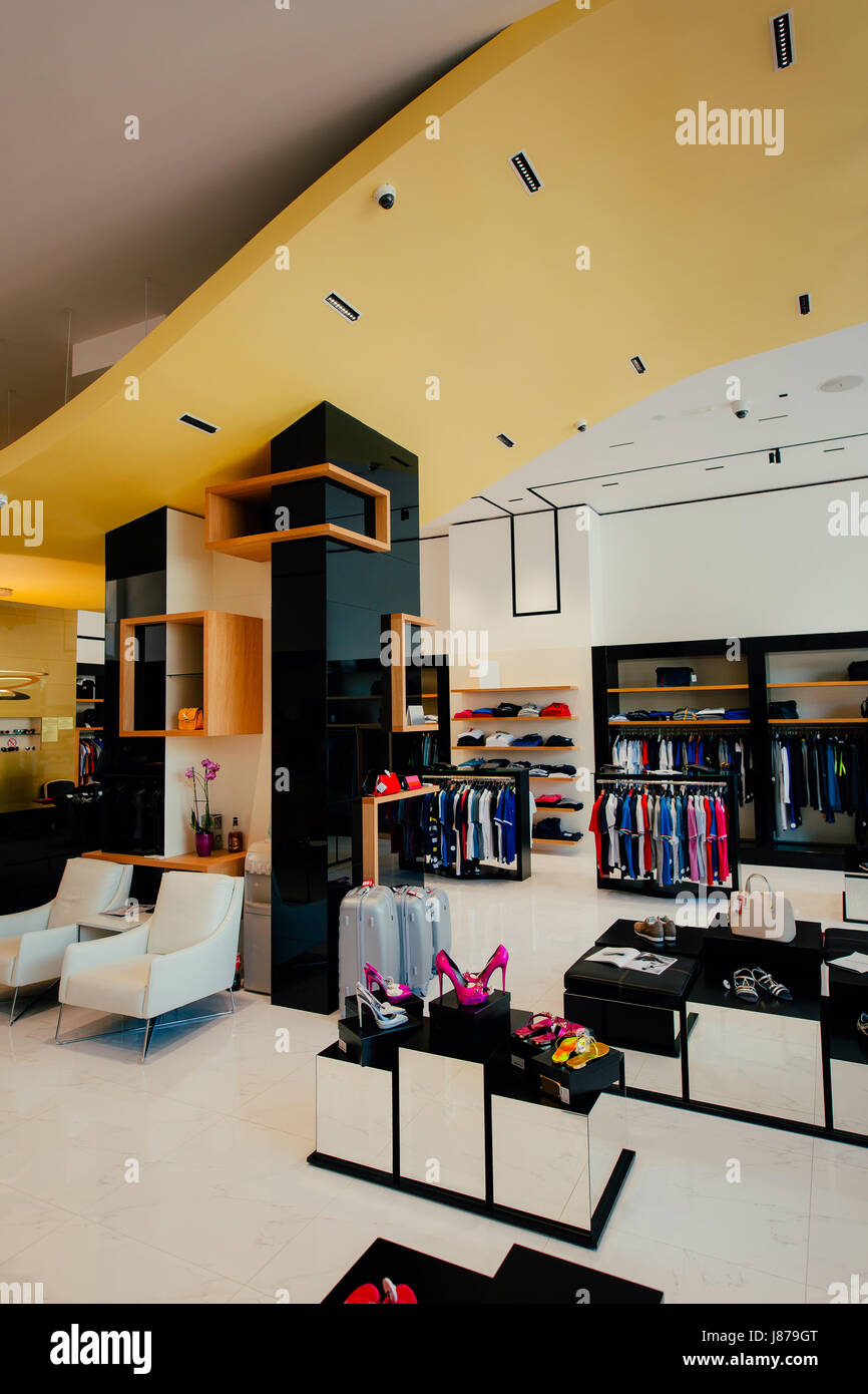 Interior of a clothing store. Clothing for men and women on the store ...