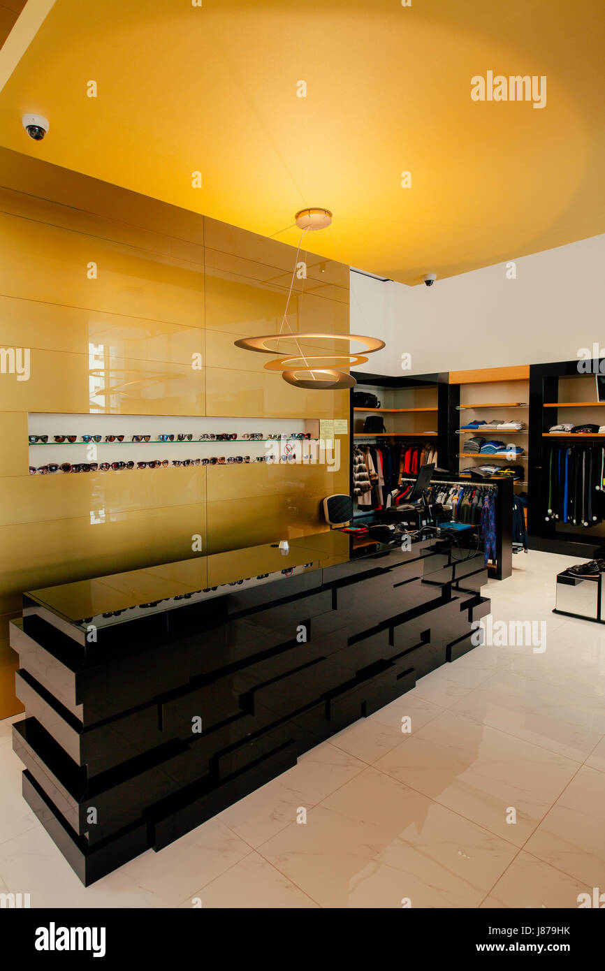 Interior of a clothing store. Clothing for men and women on the store ...