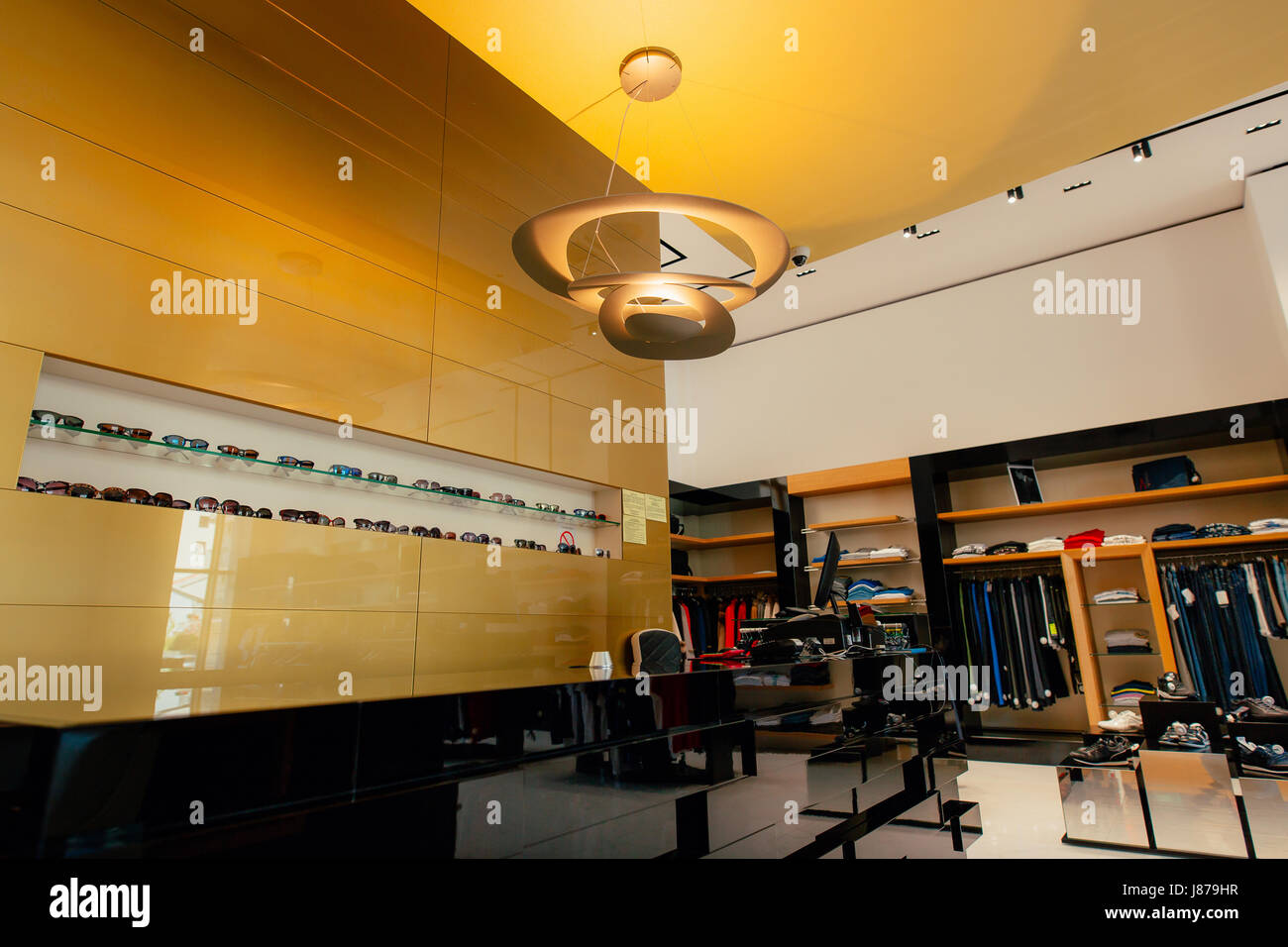 Interior of a clothing store. Clothing for men and women on the store ...