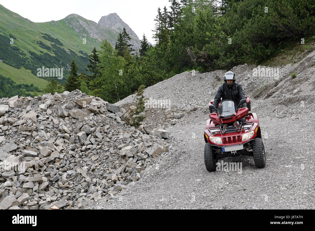 with the quad through the mountains Stock Photo - Alamy