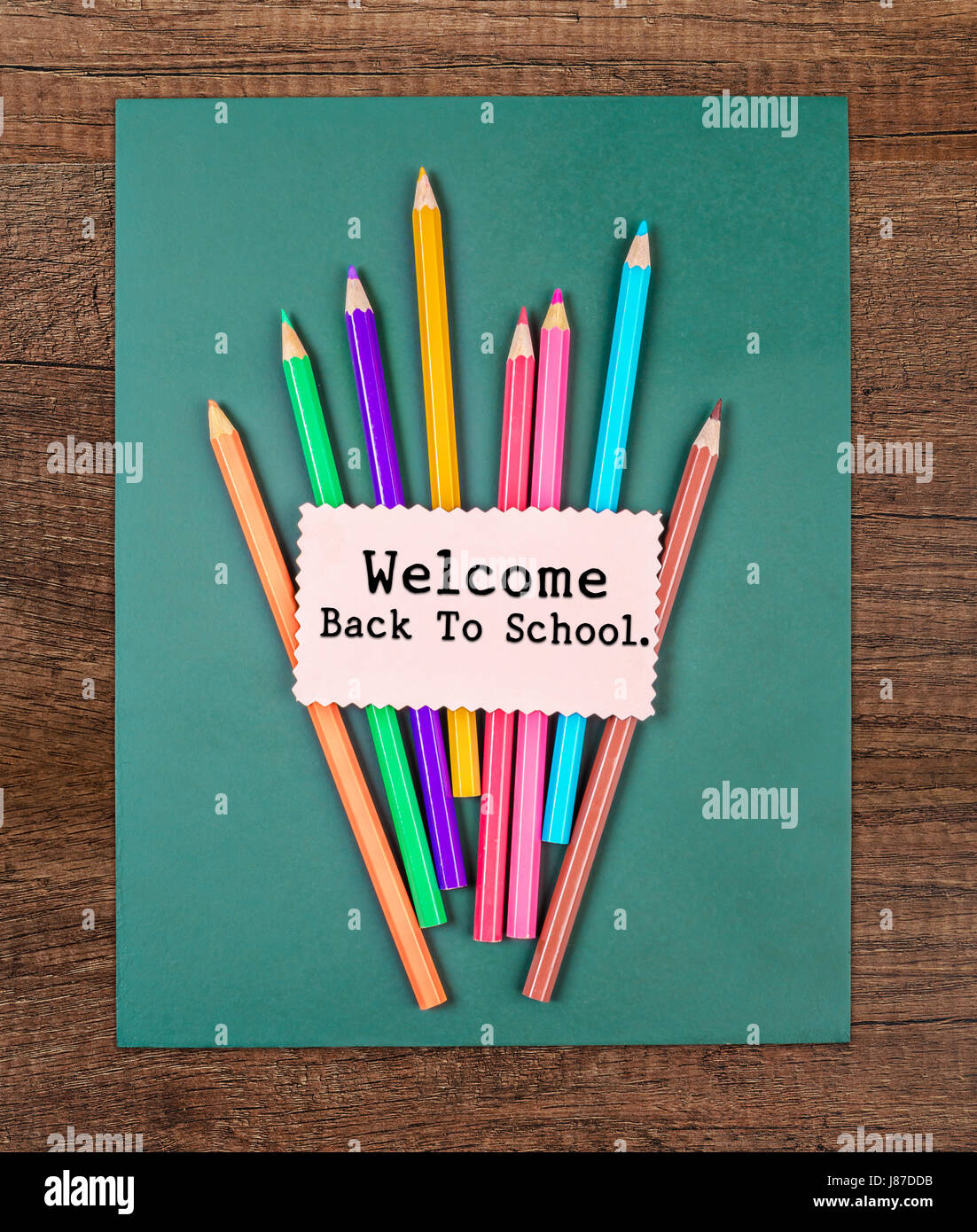 welcome back to school word and color pencil on green chalkboard on ...