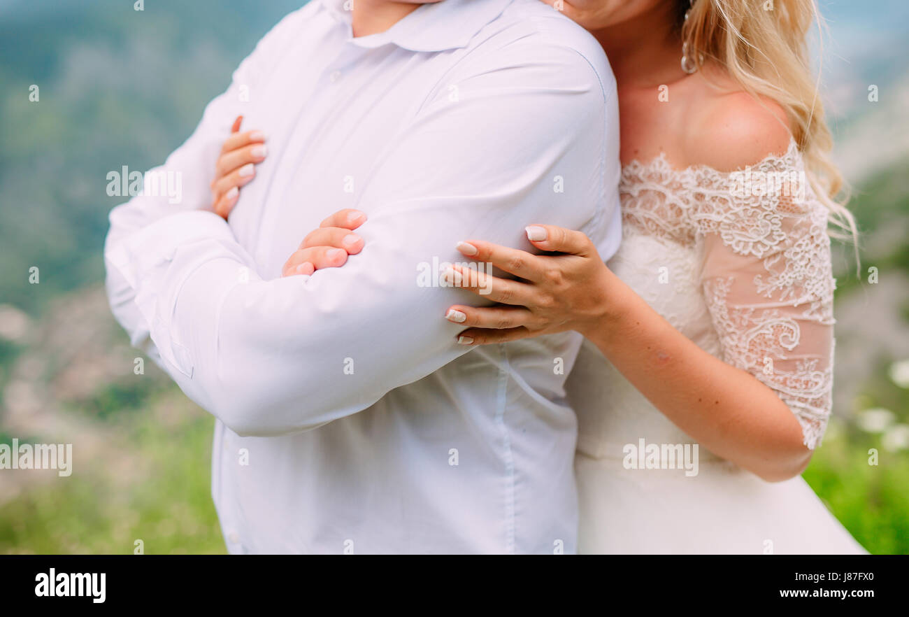 The bride is hugging the groom. Wedding in Montenegro Stock Photo - Alamy