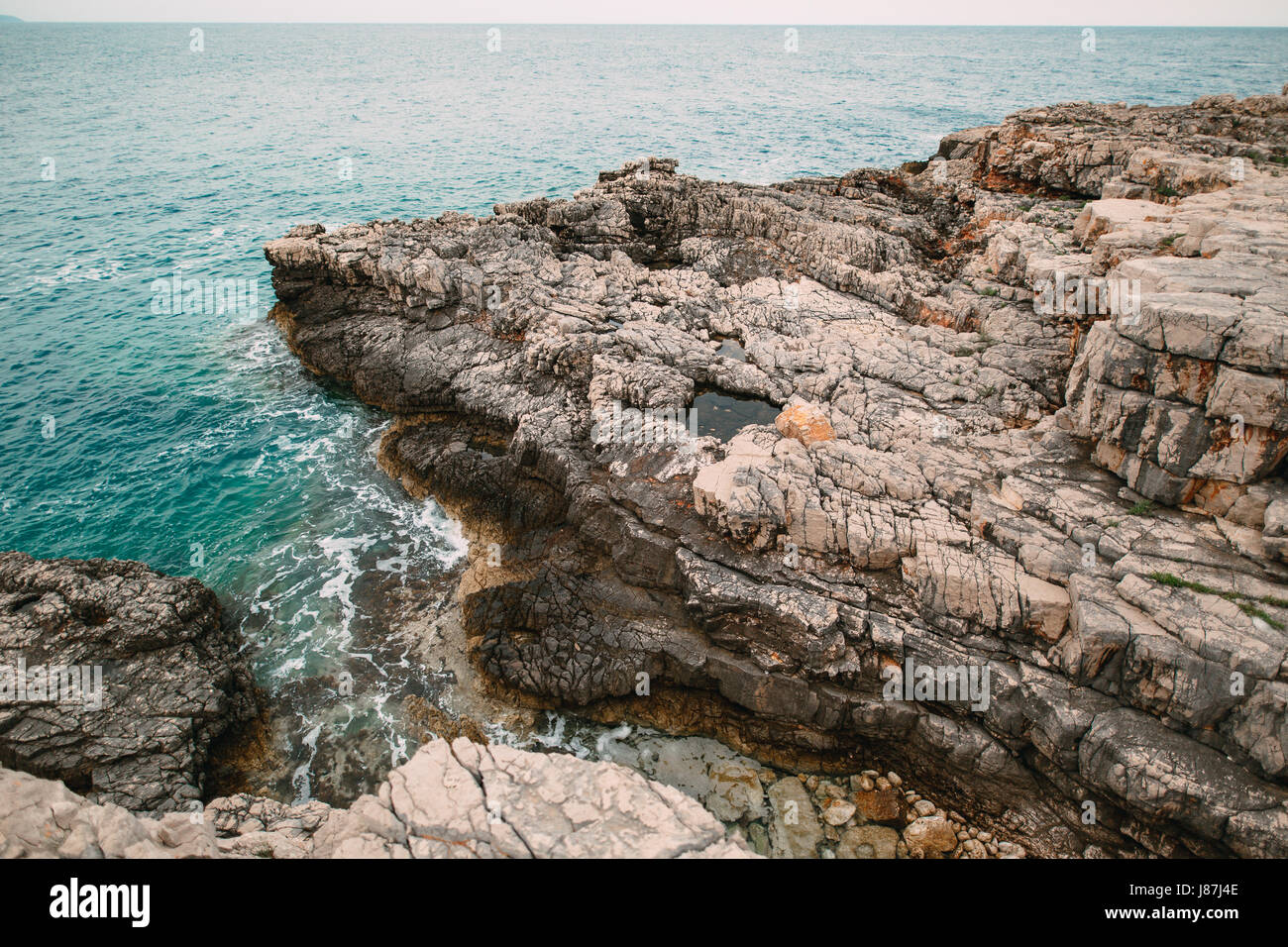 Rocks on the sea in Montenegro. Rocky coast. Wild beach. Dangerous ...