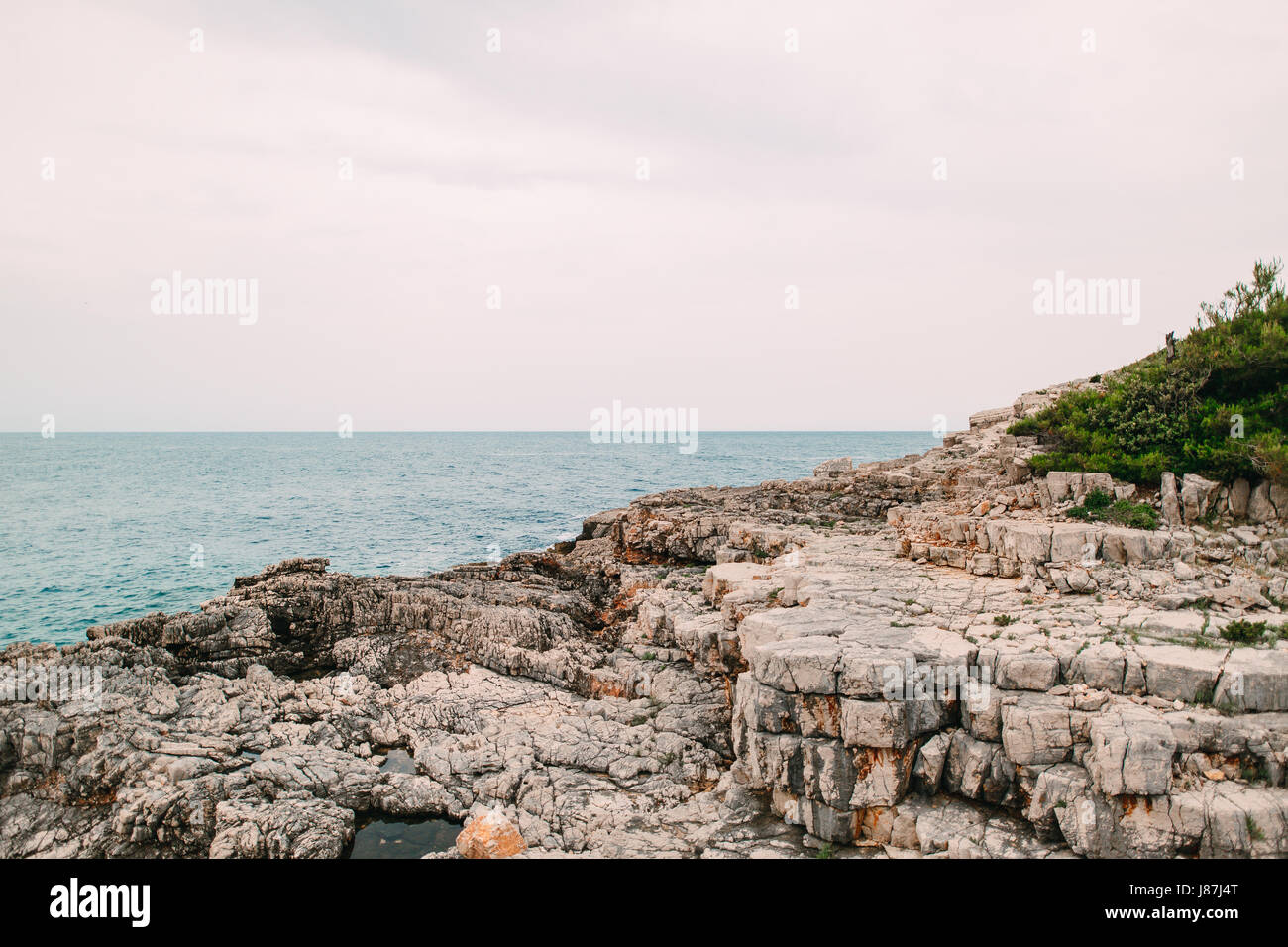 Rocks on the sea in Montenegro. Rocky coast. Wild beach. Dangerous ...