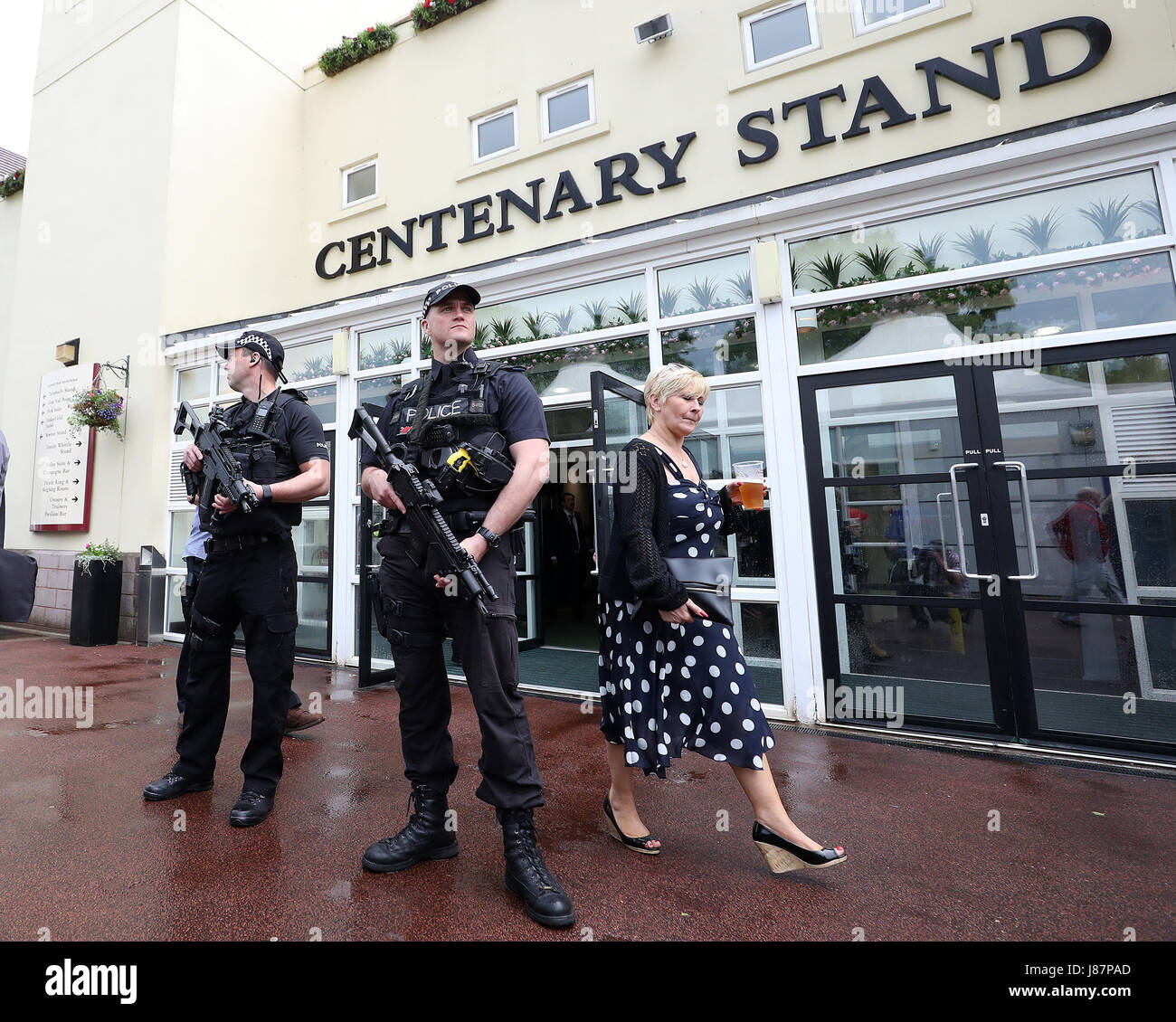 Armed police stand inside Haydock Park Racecourse Stock Photo - Alamy